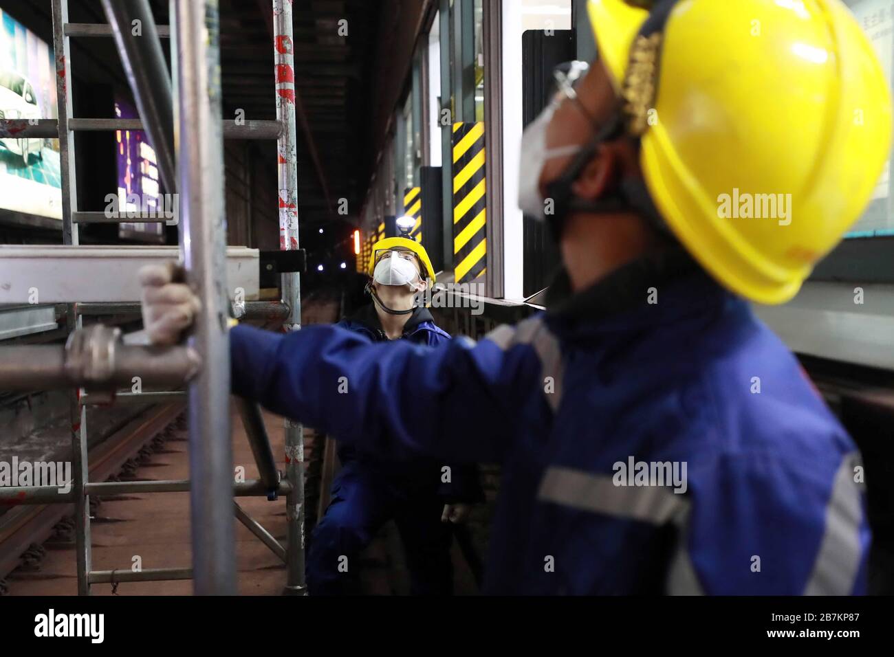 Workers line before going to do maintenance service for subways of 5 ...