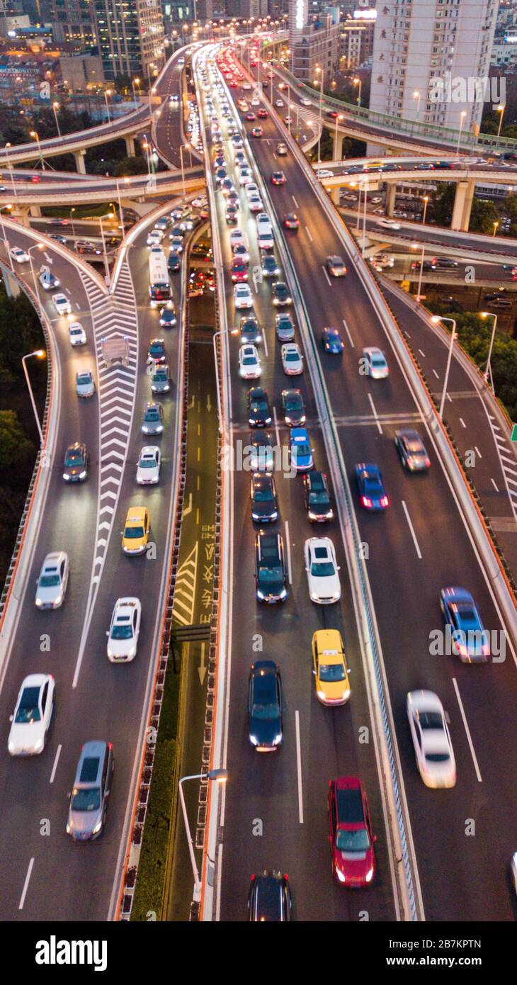 An aerial view of traffic stream composed of vehicles moving on skyways ...