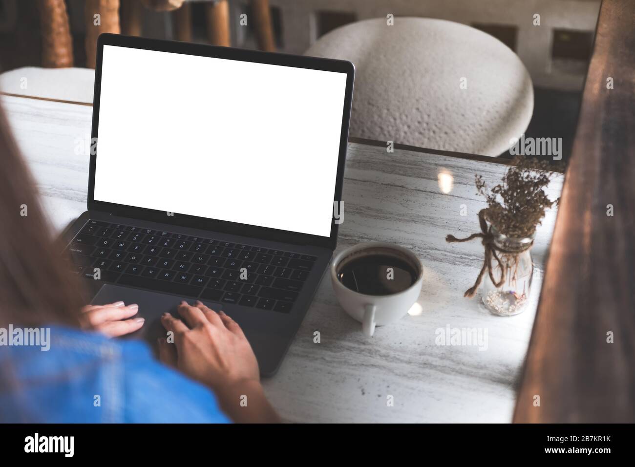 Mockup image of a woman using and typing on laptop with blank white ...