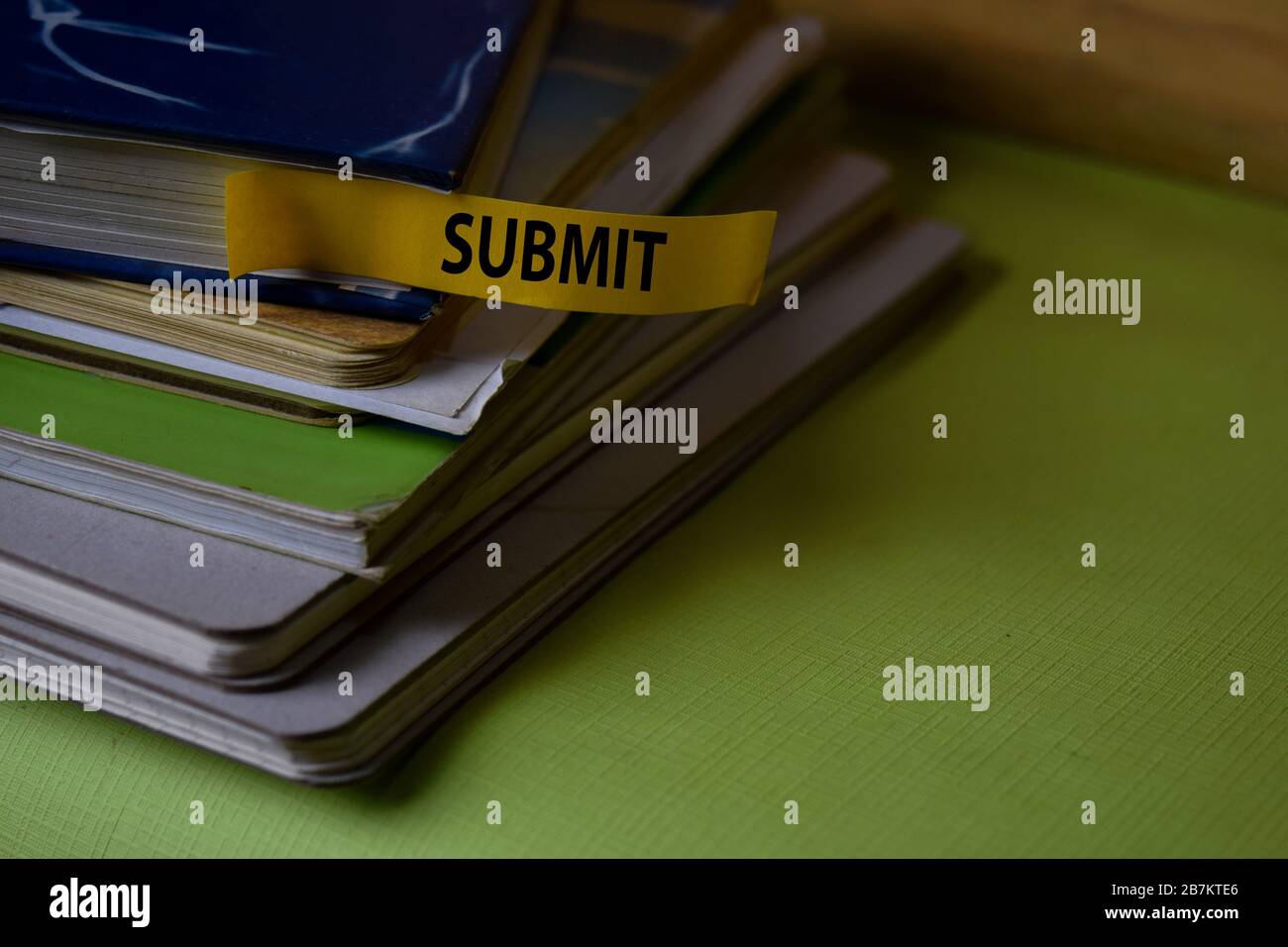 Submit write on a sticky note isolated on Office Desk. Business ...