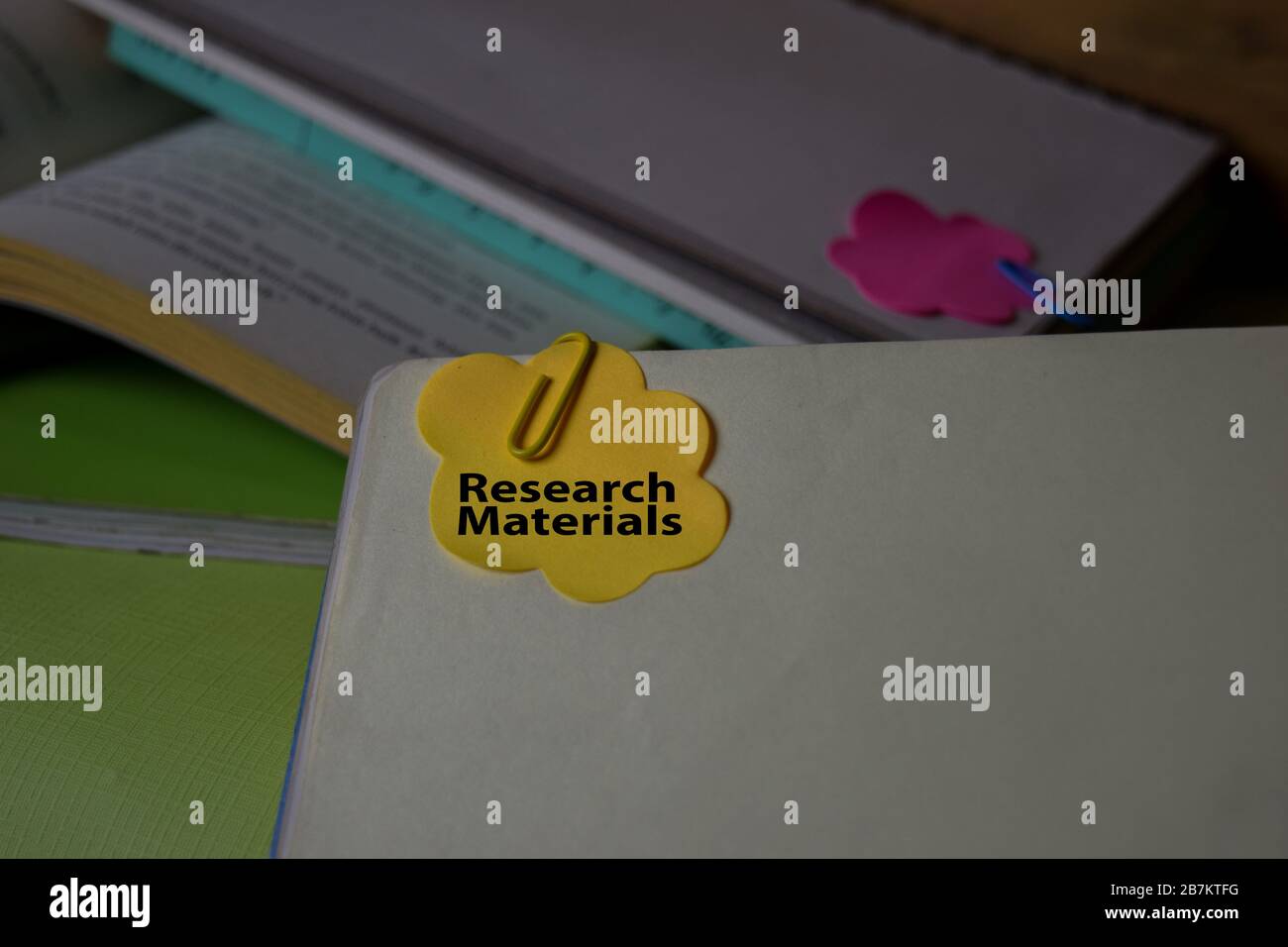 Research Materials write on a sticky note isolated on Office Desk ...