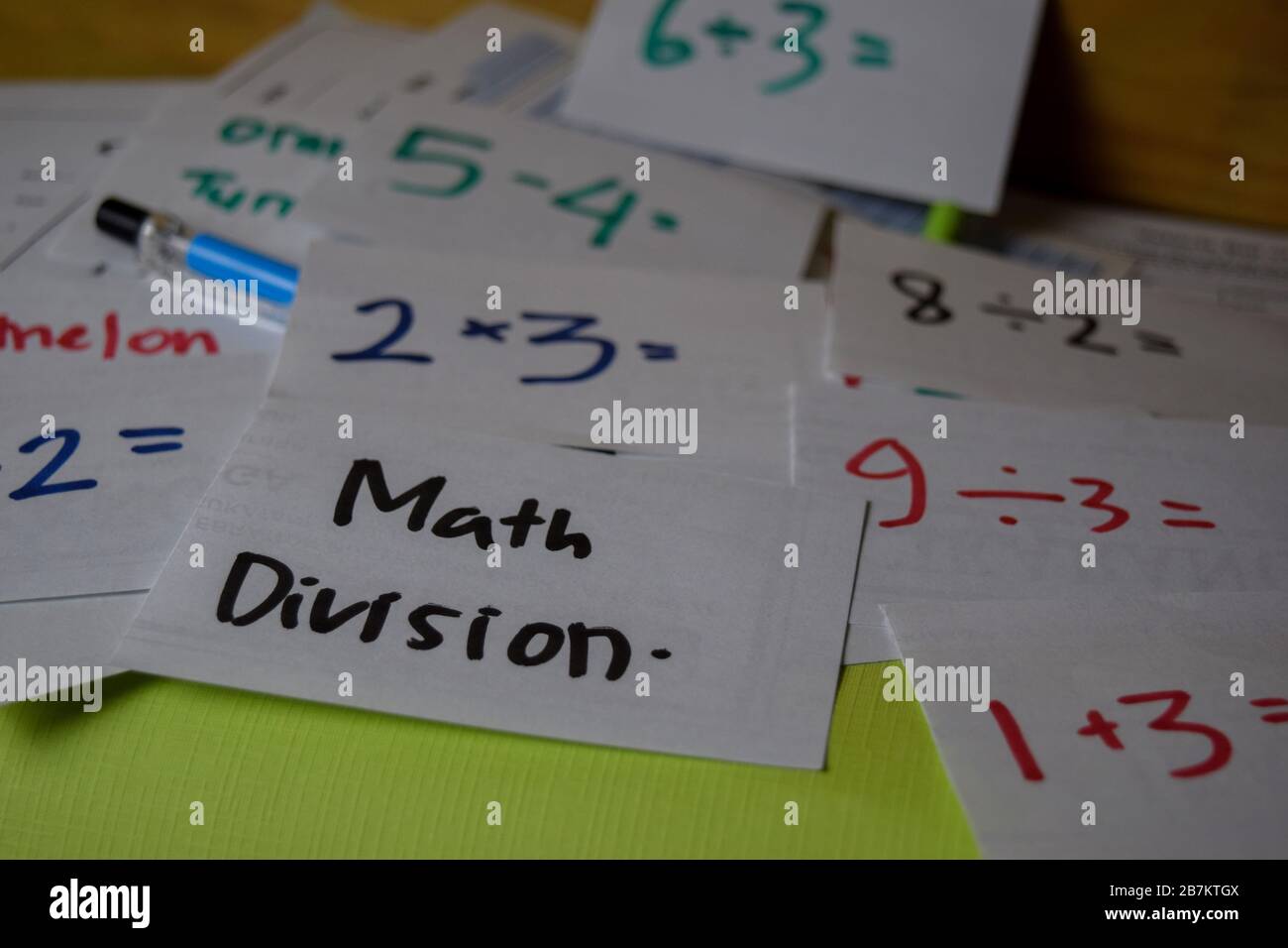 Math Division write on a sticky note isolated on Office Desk. Education ...