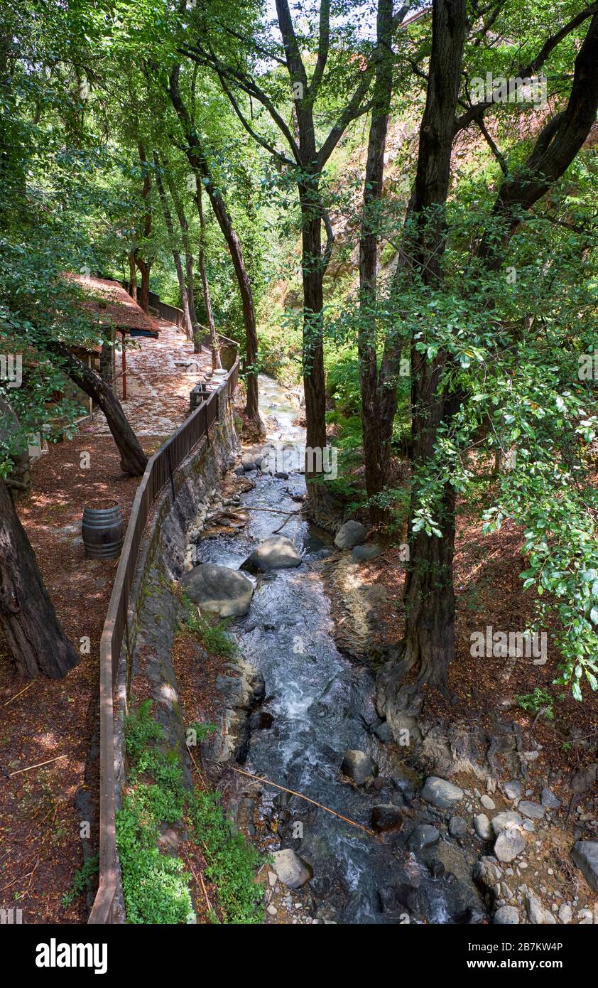 The walking path under the lush greenery along the river Clarios in the ...