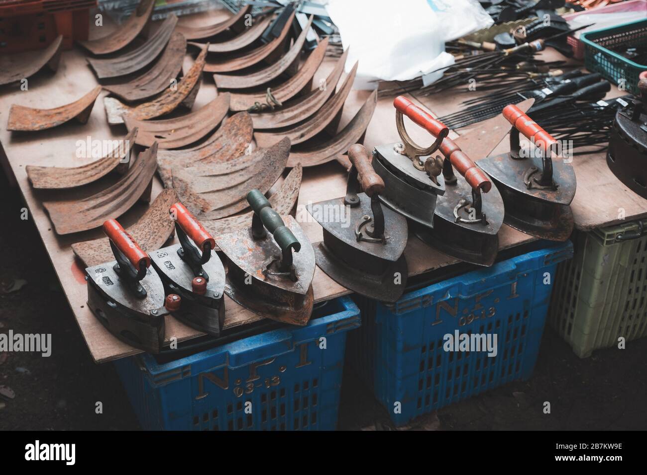 A local shop in market selling an old steel coal irons Stock Photo - Alamy
