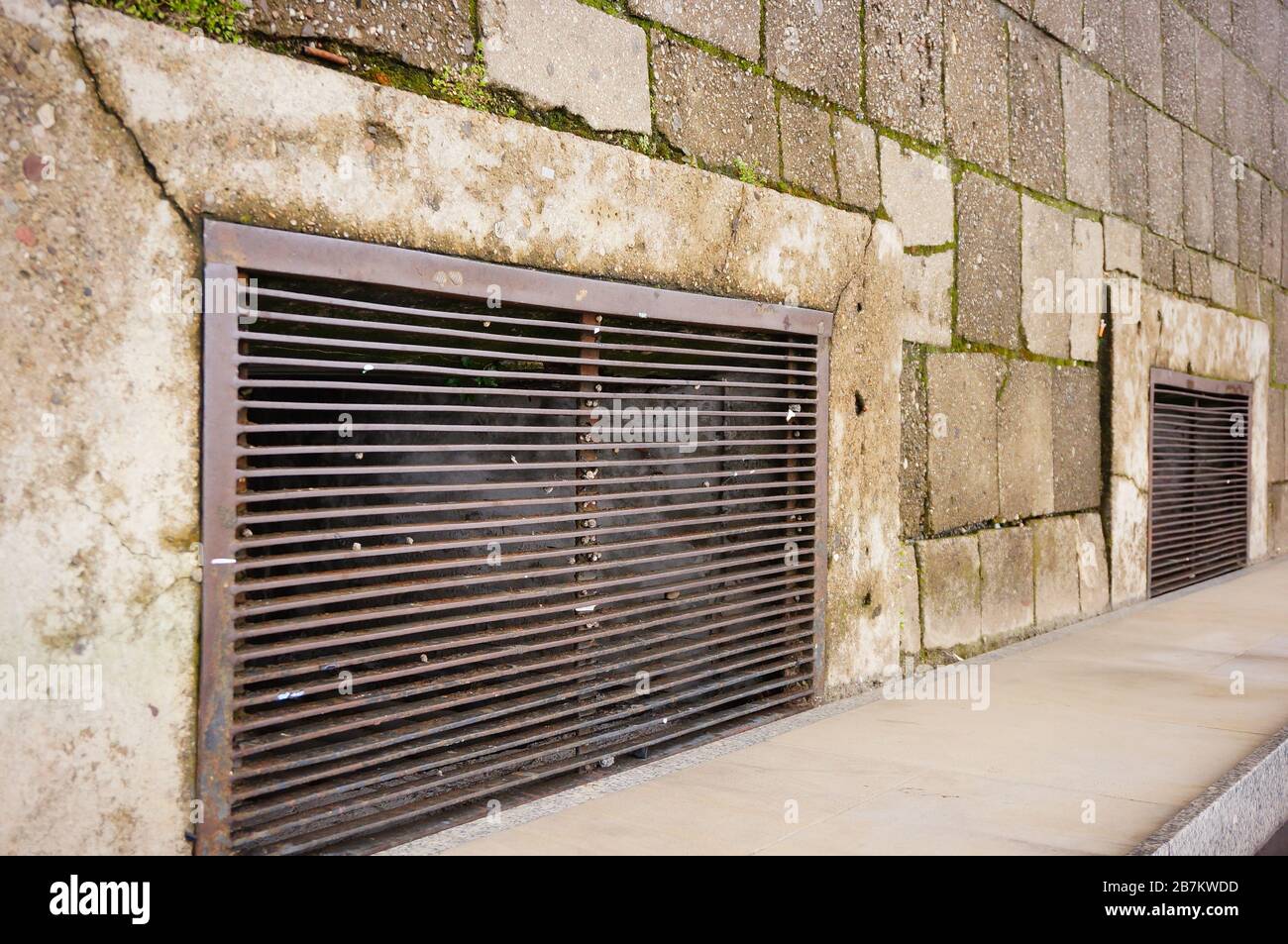 Vertical high angle shot of a rain grid drainage in the street Stock ...