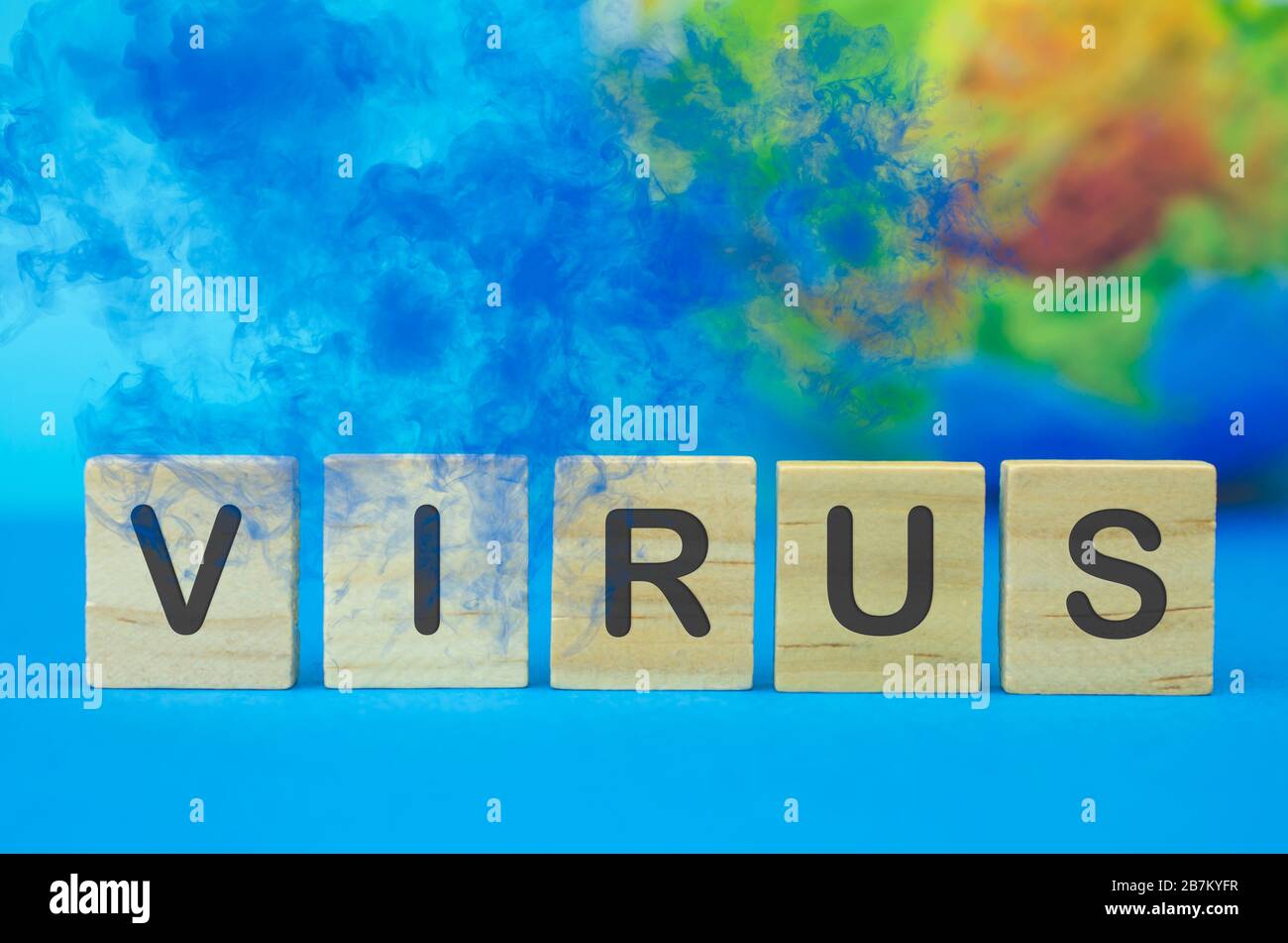 VIRUS inscription on wooden cubes on the background of the planet Earth ...