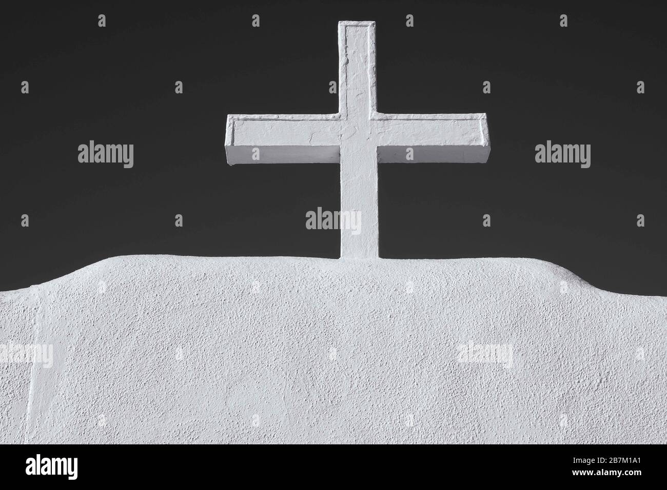 Grayscale shot of a cross on top of the roof in Northern New Mexico ...