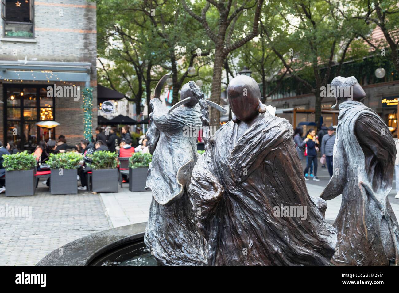 Sculpture in square, Xintiandi, Shanghai, China Stock Photo - Alamy