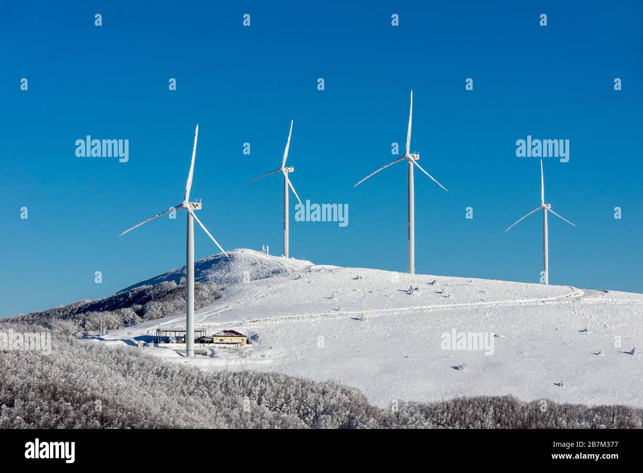 Frozen wind turbines in mountain high Stock Photo - Alamy