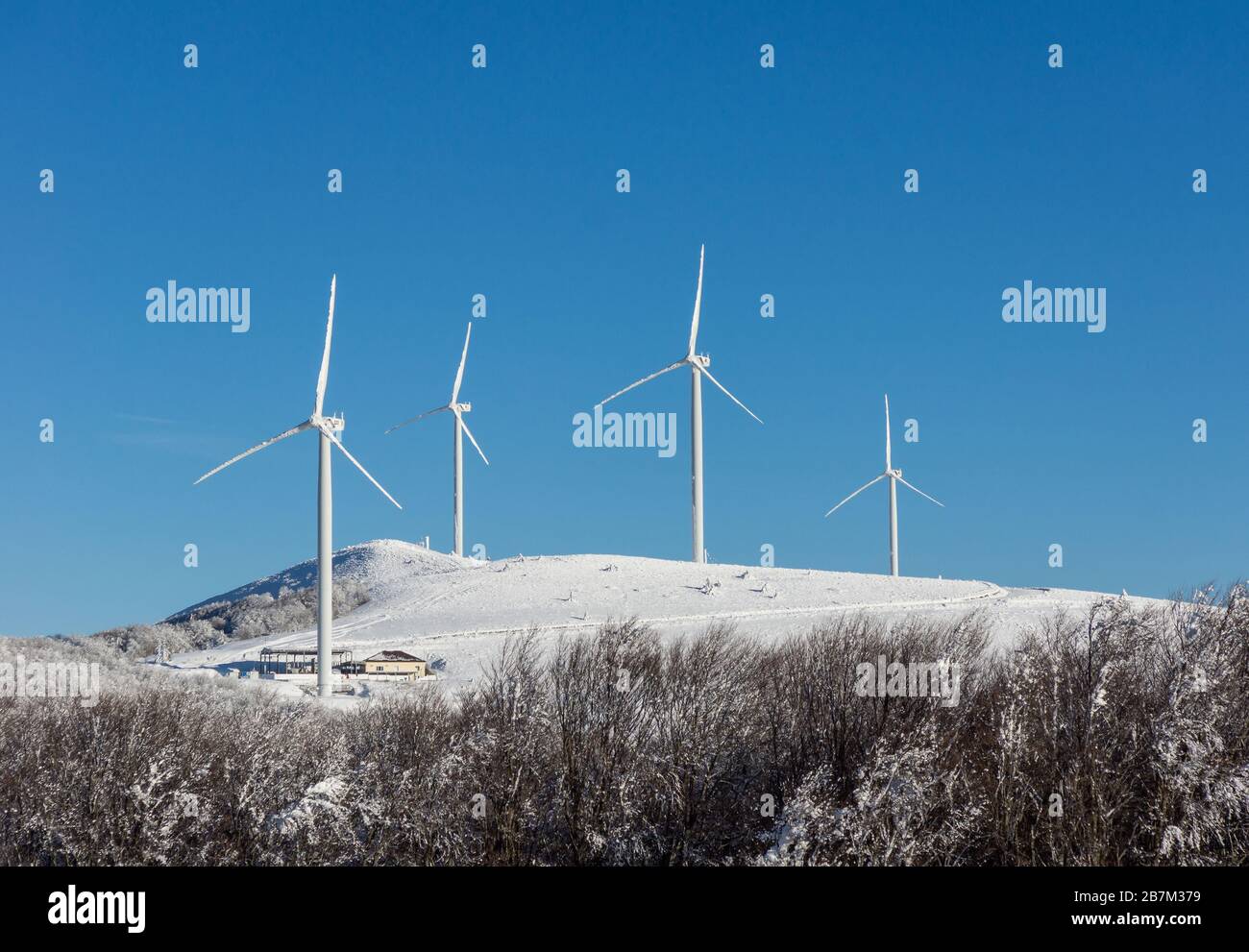 Frozen wind turbines in mountain high Stock Photo - Alamy