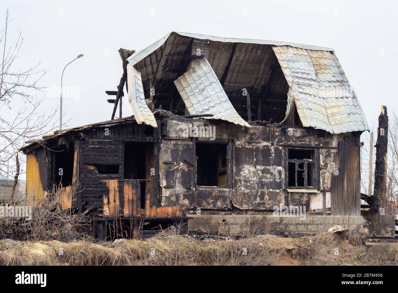 A sinful house, arson incident. Broken roof and glass windows, charred ...
