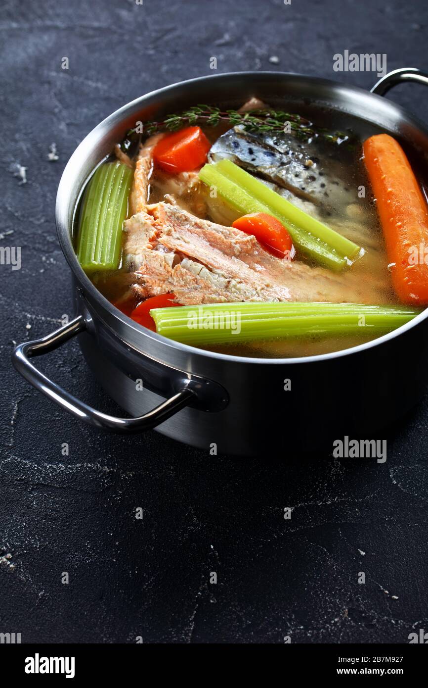 slow-cooked fish broth or soup of salmon, onion, carrot, celery, herbs ...