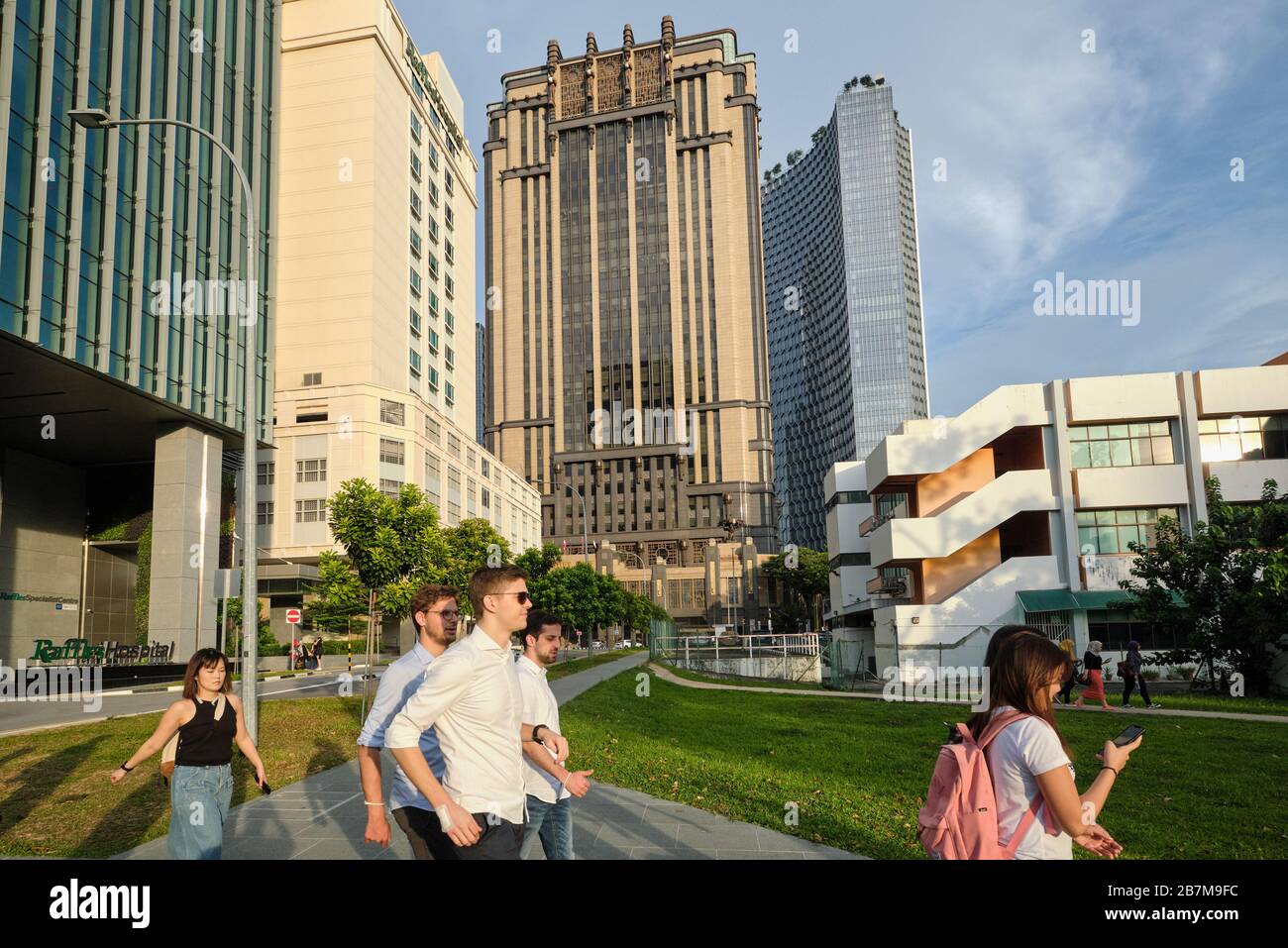 High rise office buildings, Caucasian tourists & other pedestrians in ...