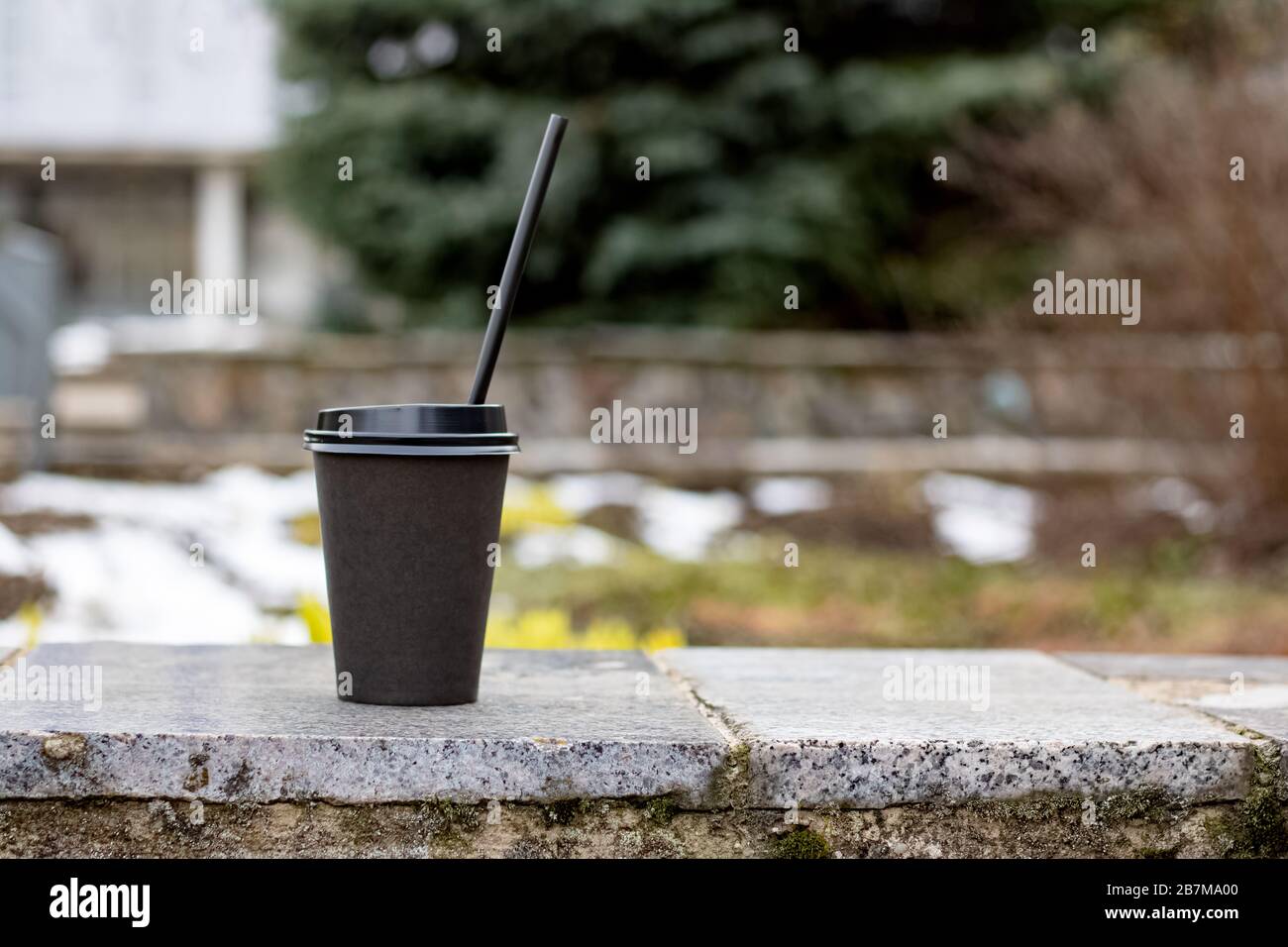 Paper cup with coffee on a concrete bench Stock Photo - Alamy