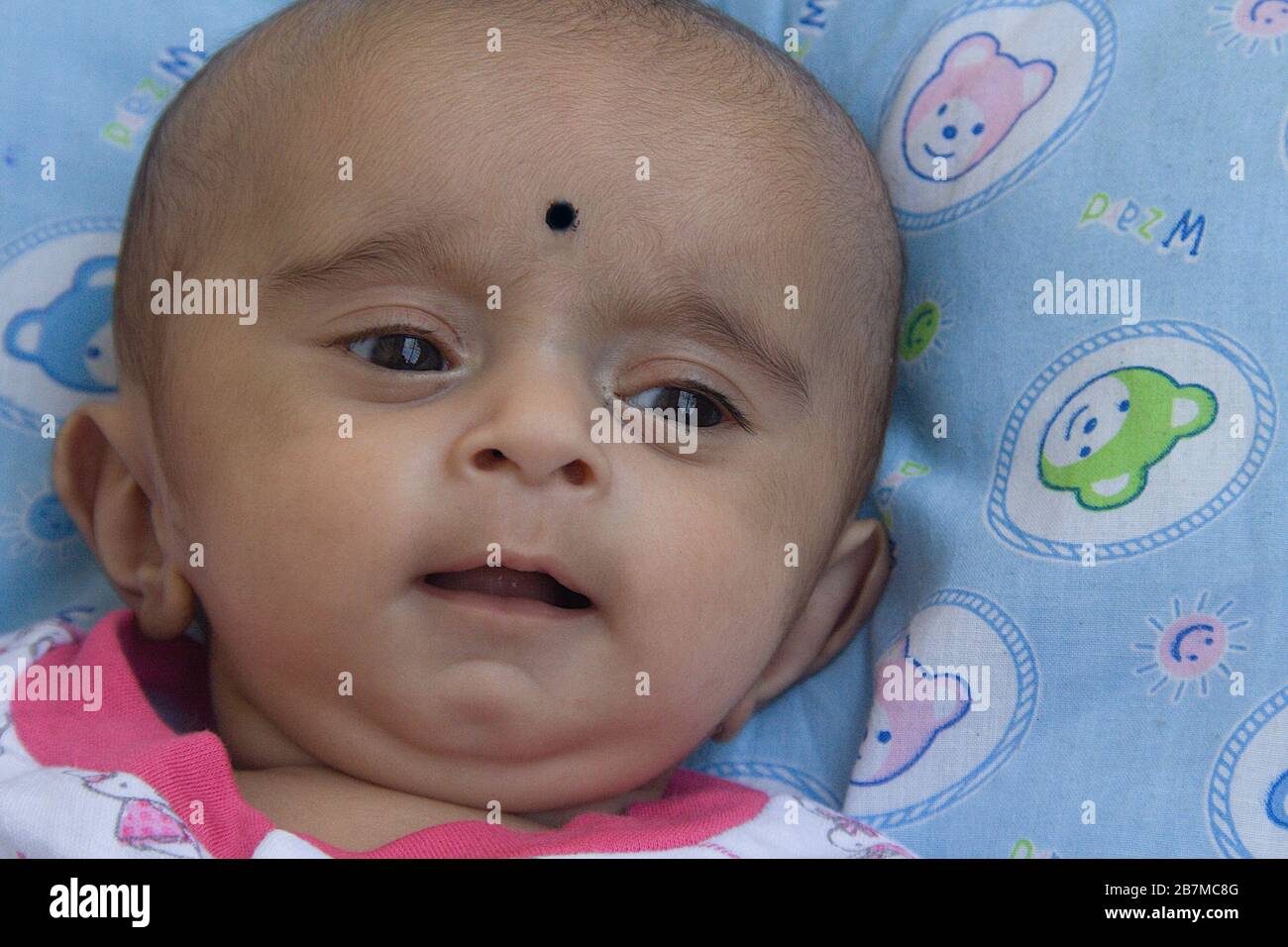 Face of baby displaying innocence, serenity and calmness Stock Photo ...