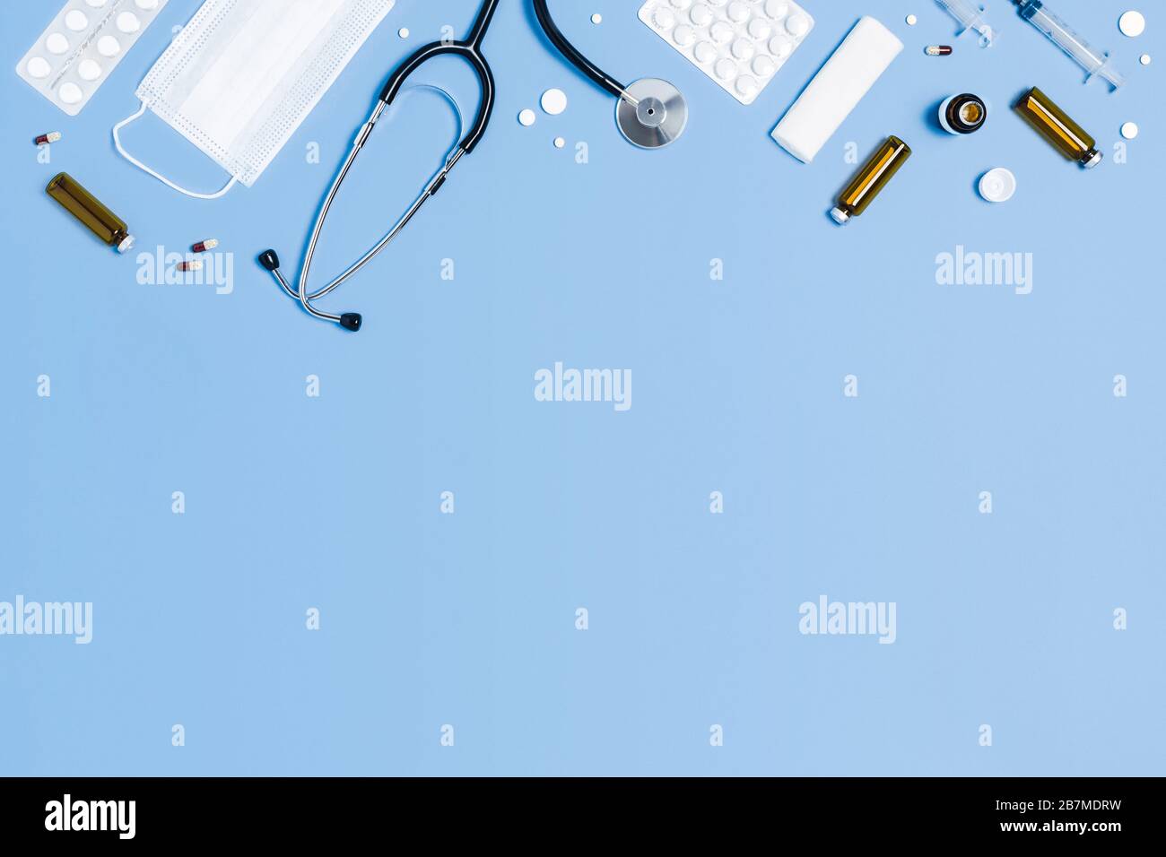 Medical blue background with different accessories: stethoscope ...