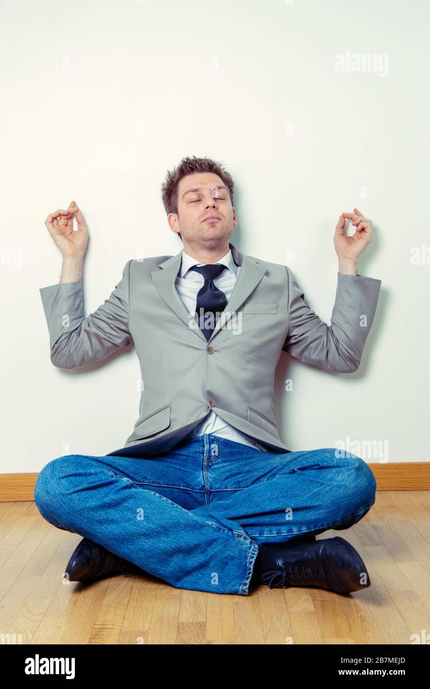 Portrait of freelance worker doing relaxation exercises at home sitting ...