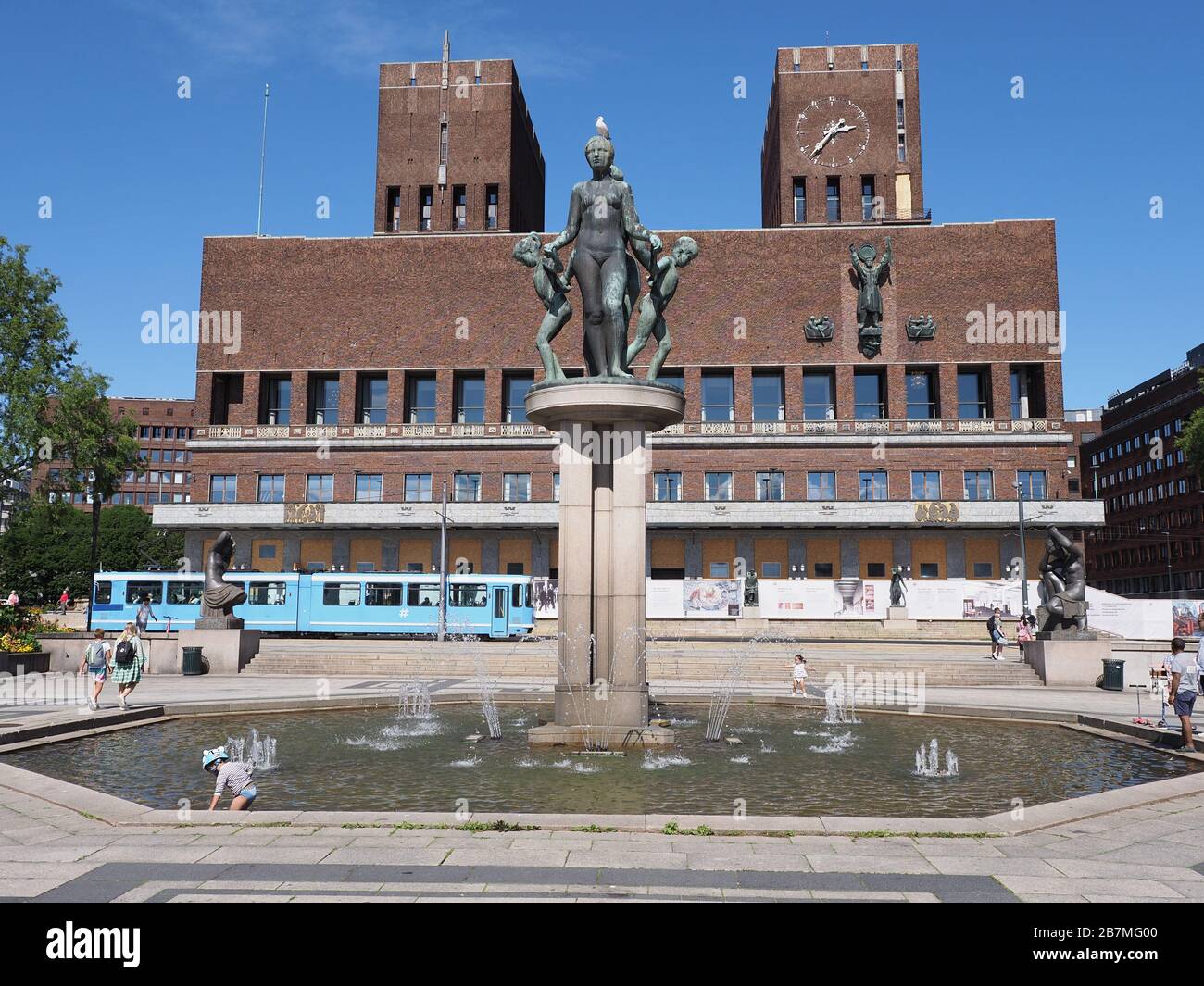 Statue and fountain in front of town hall on main square in european ...