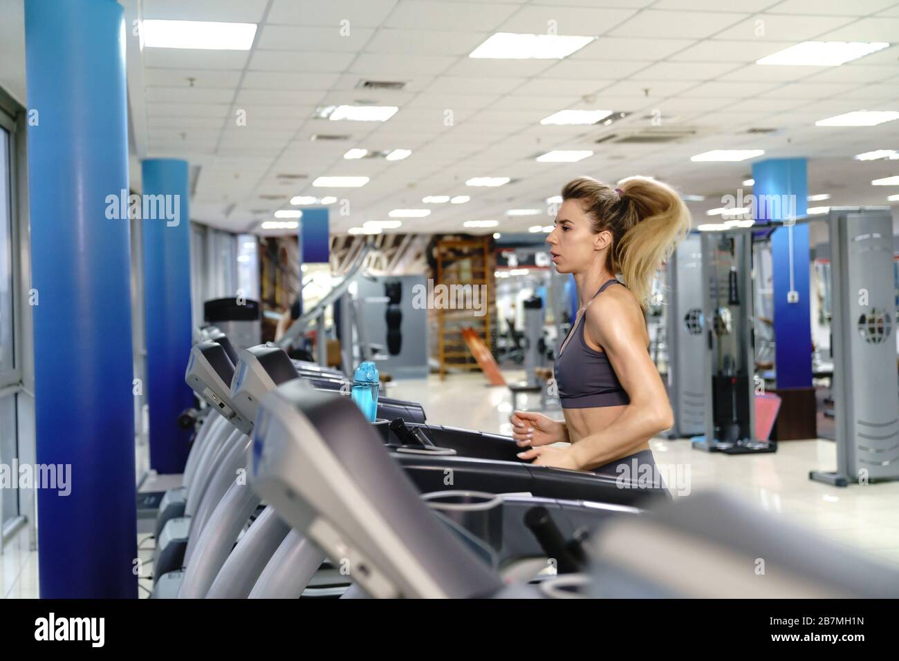 Woman on running machine hi-res stock photography and images - Alamy