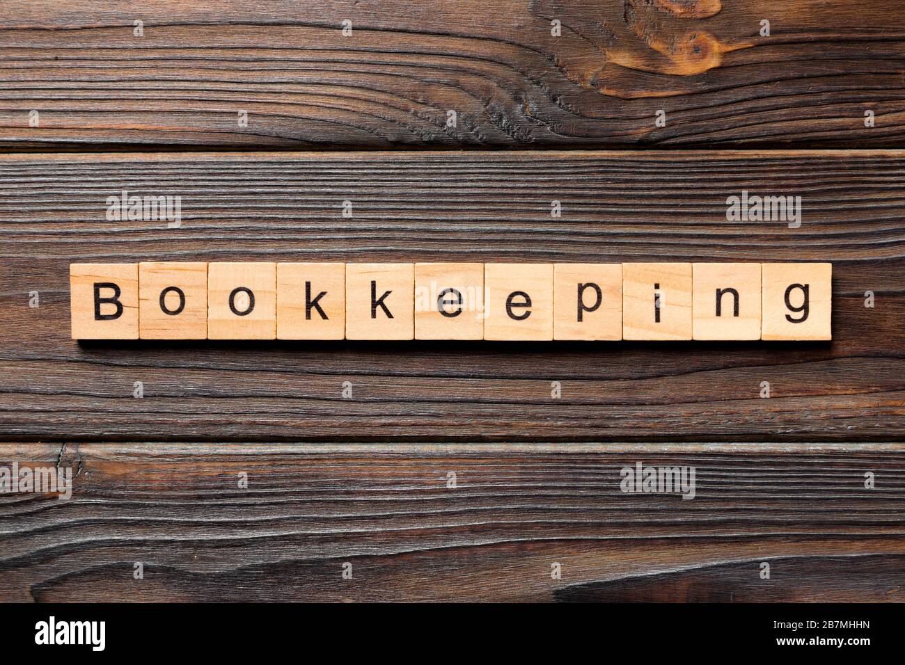 bookkeeping word written on wood block. bookkeeping text on wooden ...