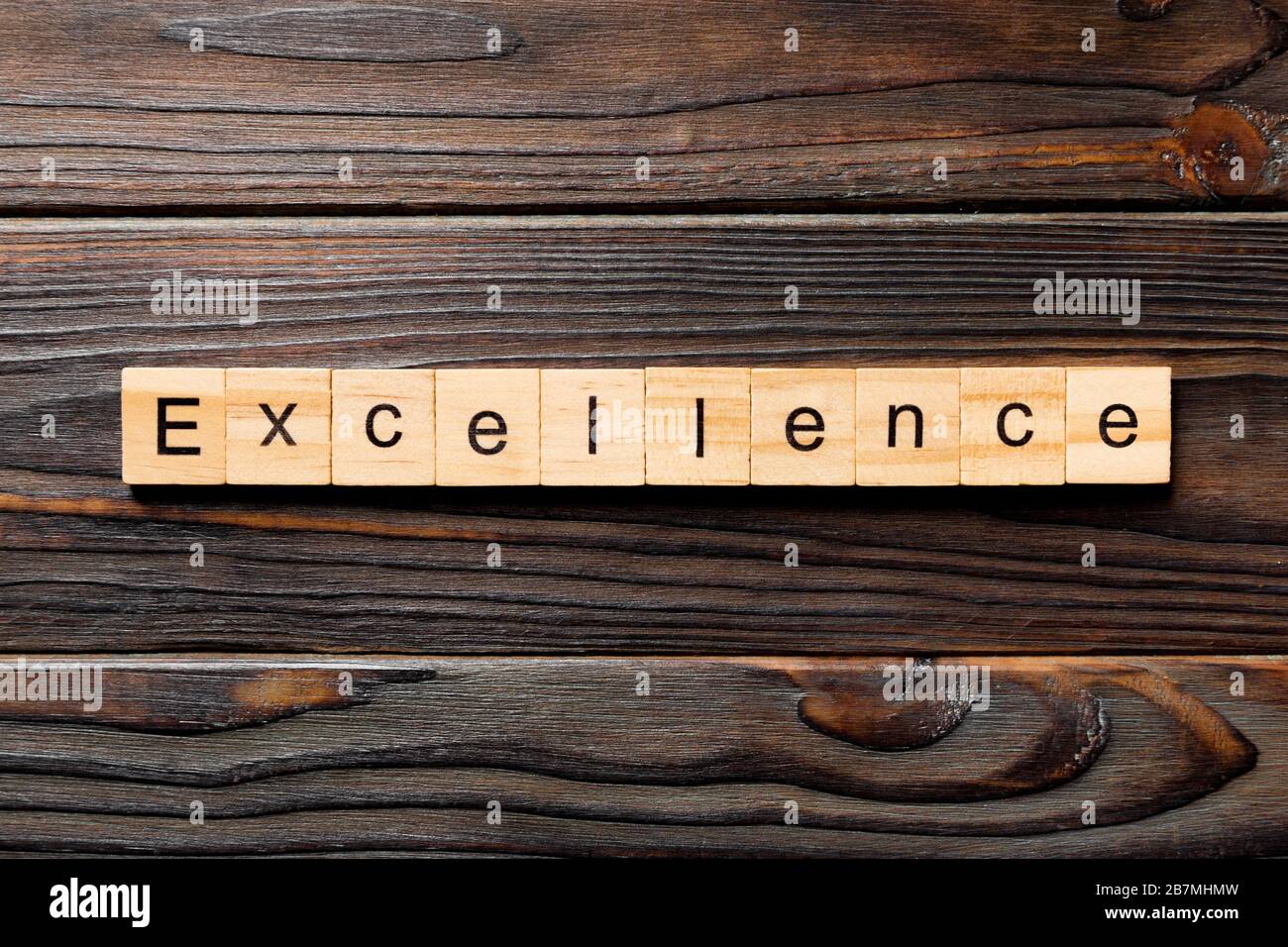 Excellence word written on wood block. Excellence text on wooden table ...