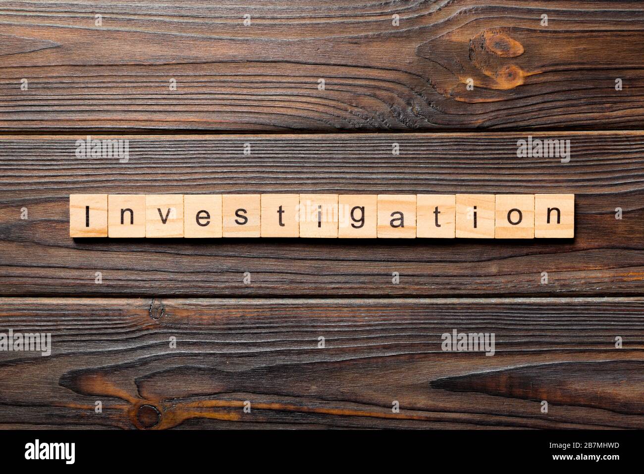 investigation word written on wood block. investigation text on table ... investigation word written on wood block. investigation text on table ...