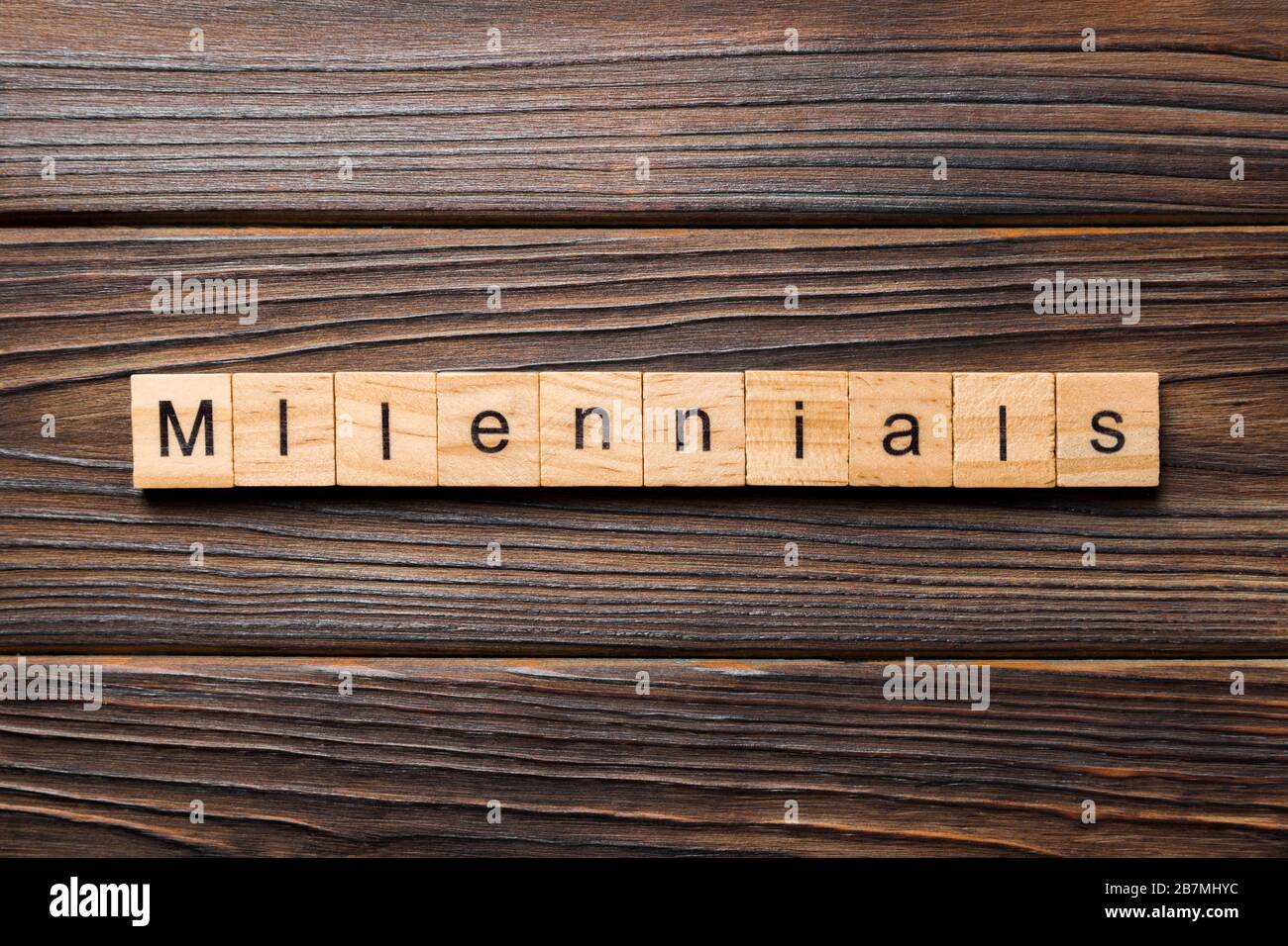 millennials word written on wood block. millennials text on table ...