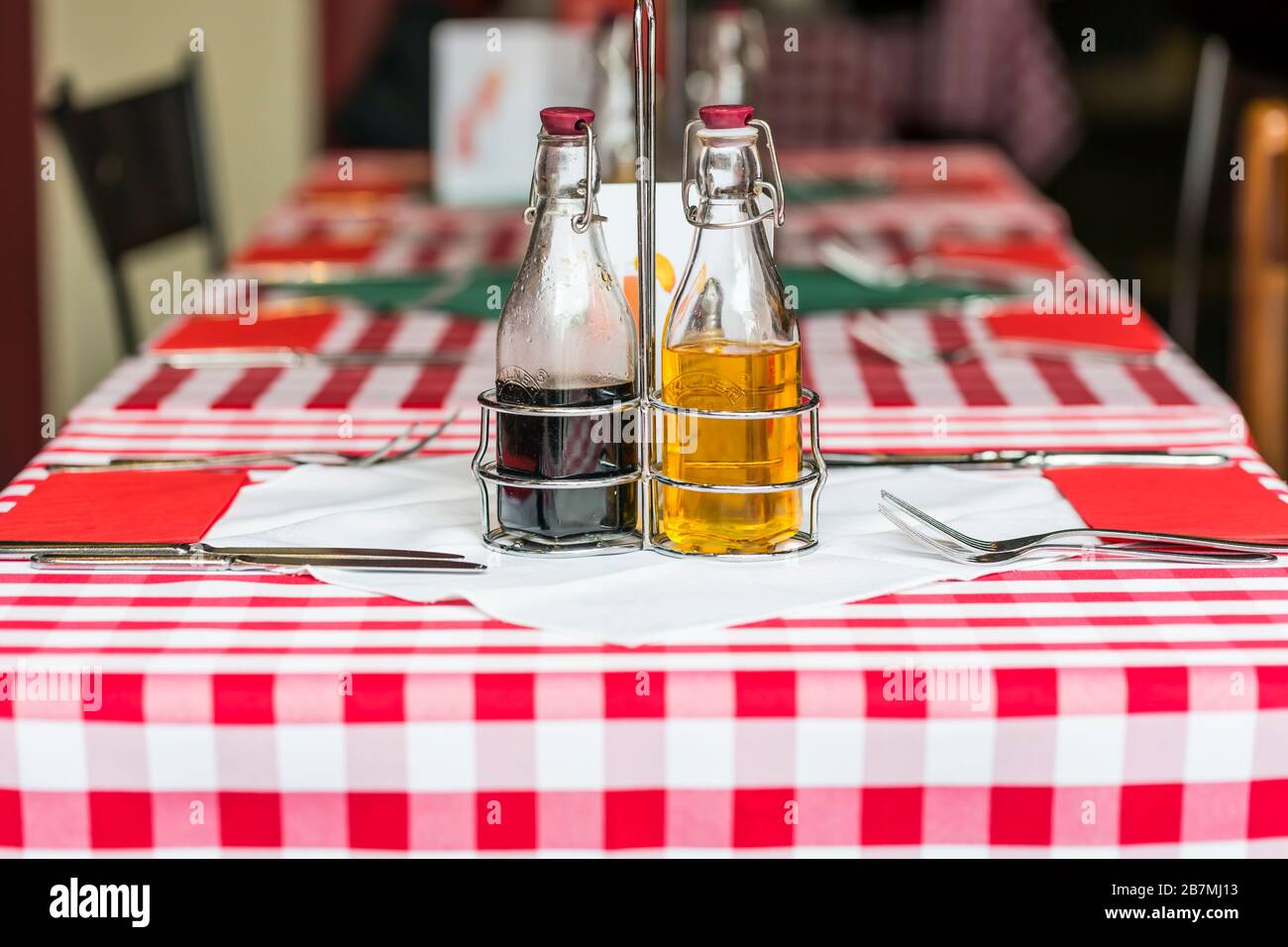 Looking in through a window to condiments on a restaurant table in ...