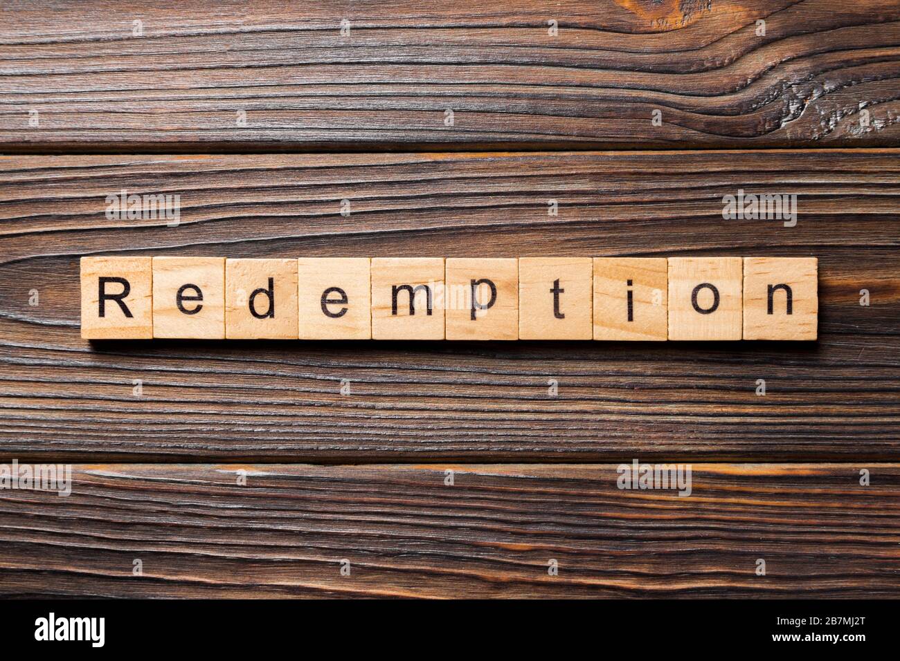 redemption word written on wood block. redemption text on wooden table ...