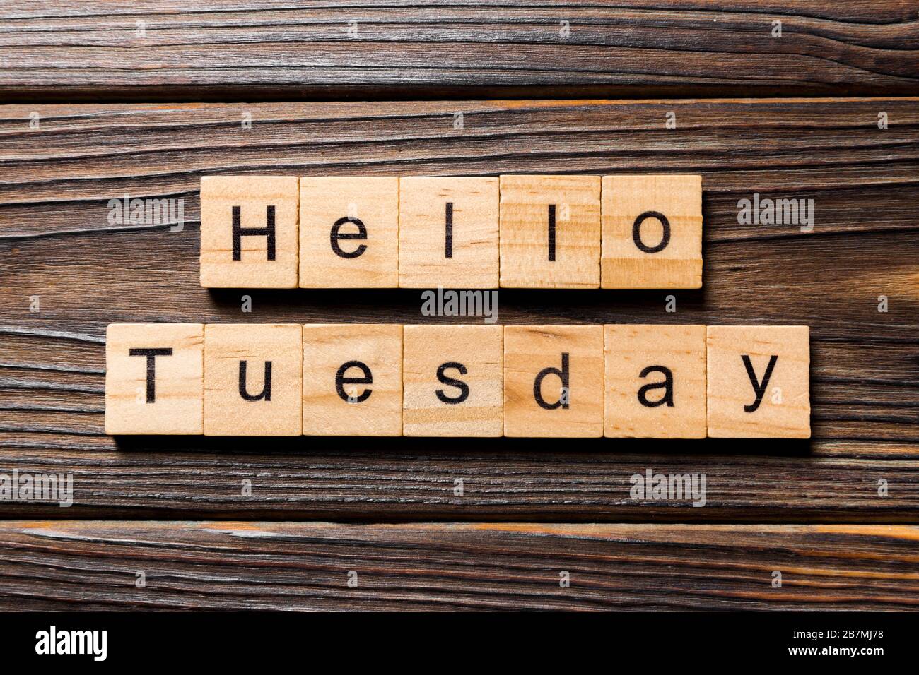 Hello Tuesday word written on wood block. Hello Tuesday text on wooden ...