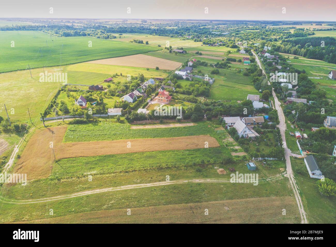 Summer rural landscape. Aerial view. View of green fields, village, and ...