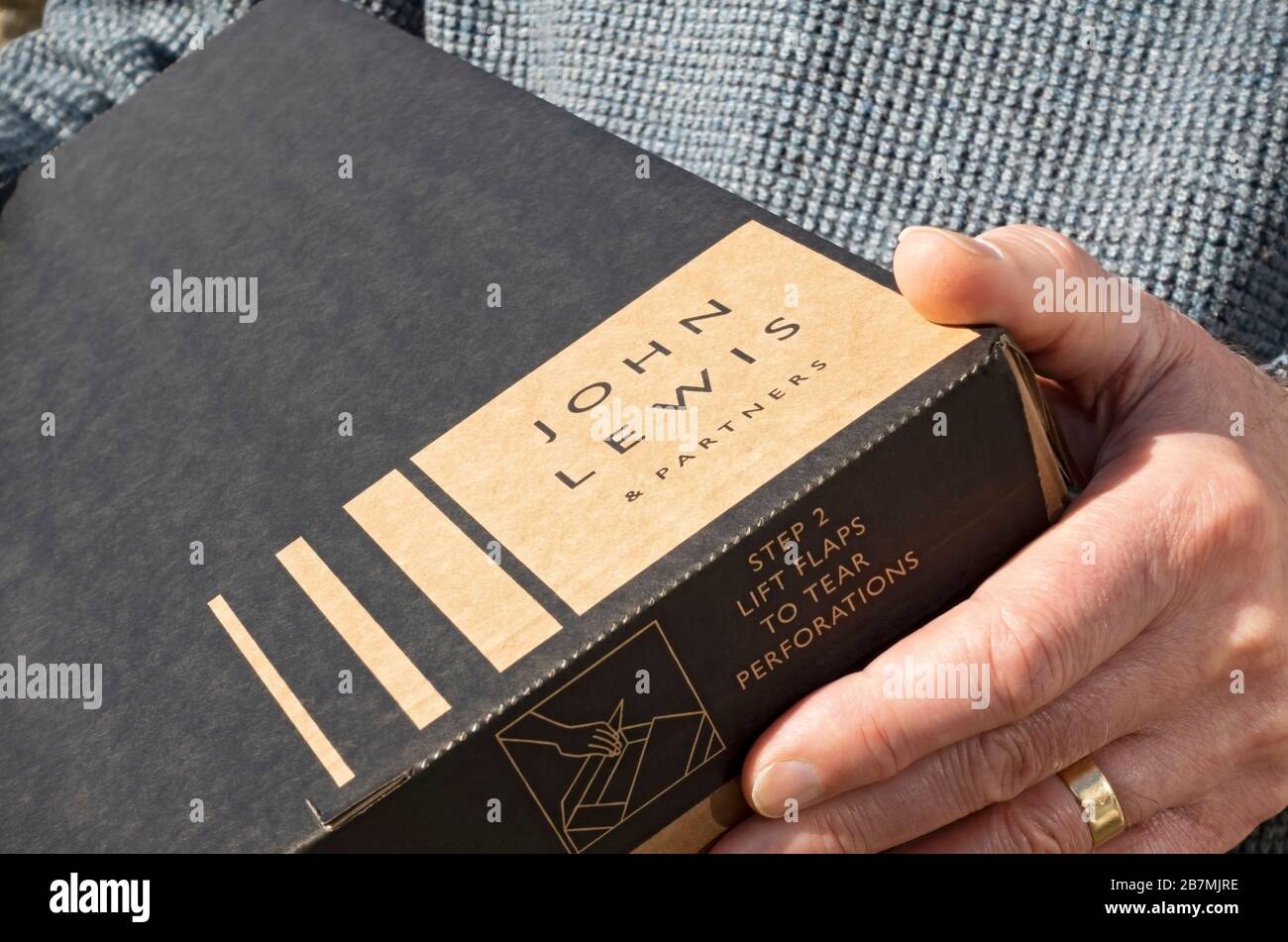 Close up of person man carrying delivering holding internet mail oreder ...