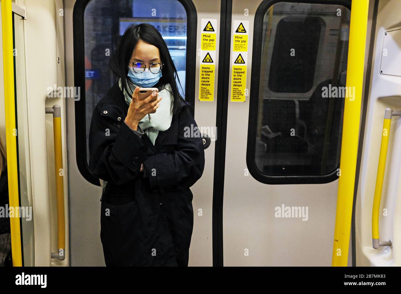 Riding a train with a face mask hi-res stock photography and images - Alamy