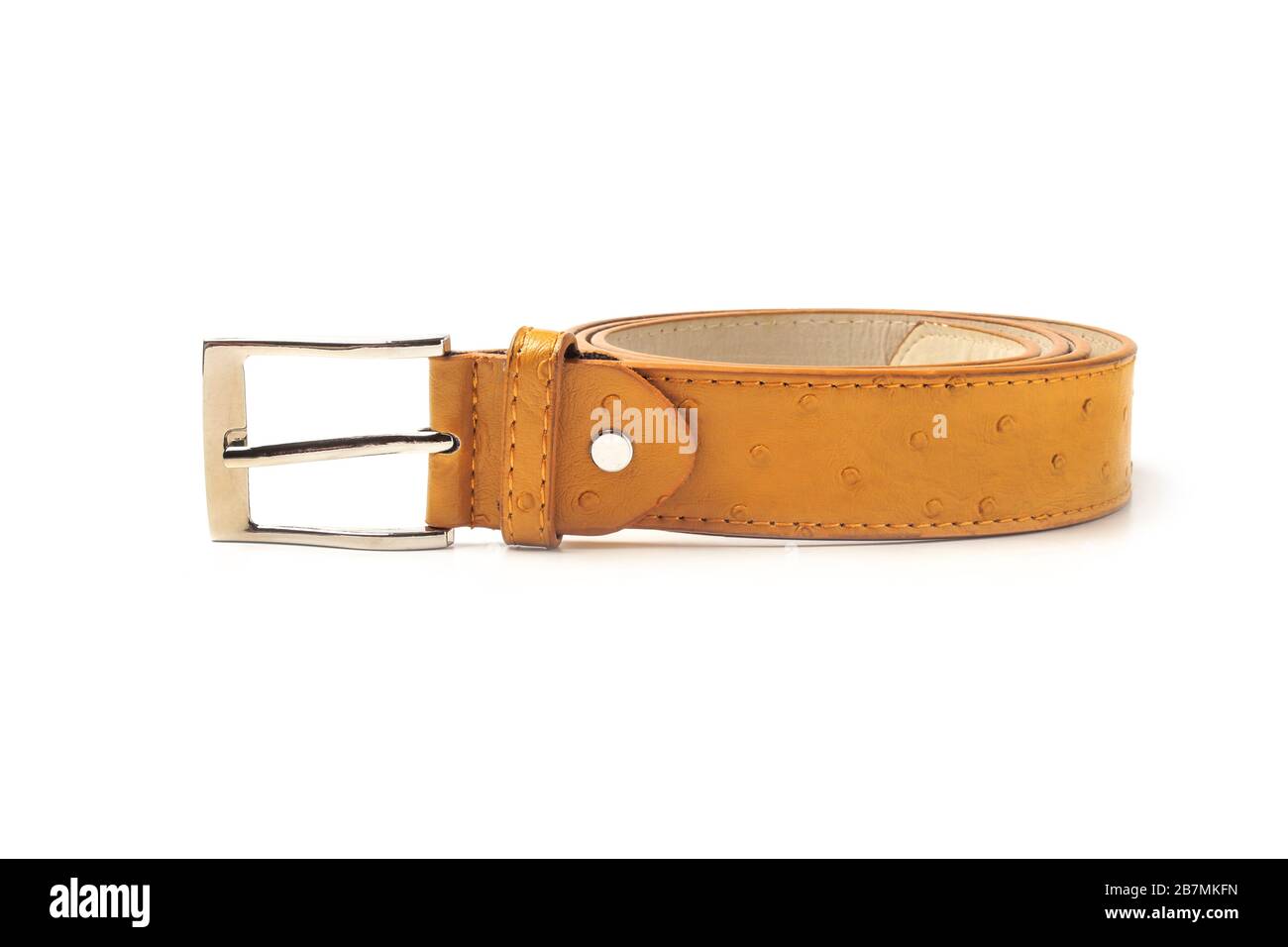 Rolled yellow leather belt isolated on white background Stock Photo - Alamy