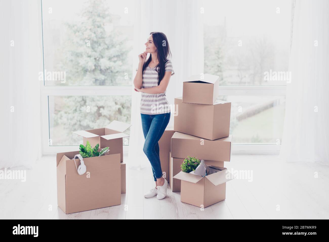 Dreamy girl is thinking how she will organize everything ih her new ...