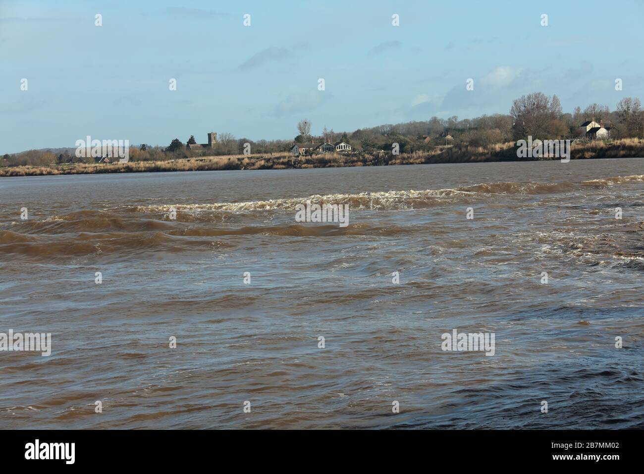 The Severn river Bore barrelling along an already swollen water of the ...