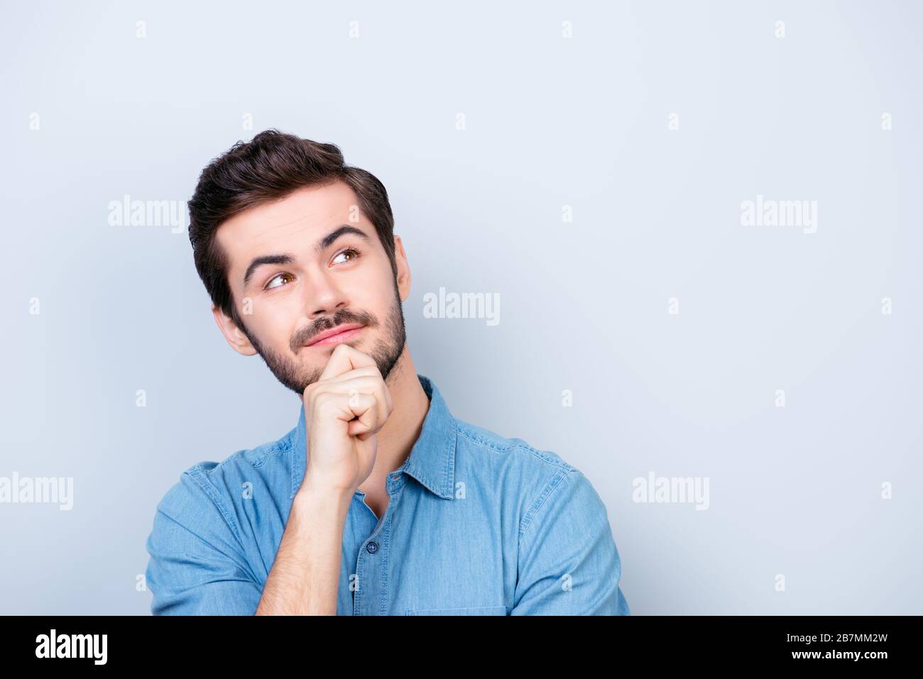Portrait of attractive minded happy young man dreaming about smth Stock ...