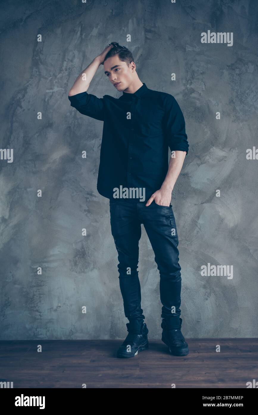 Young handsome fashion man model in black shirt, jeans and stylish ...