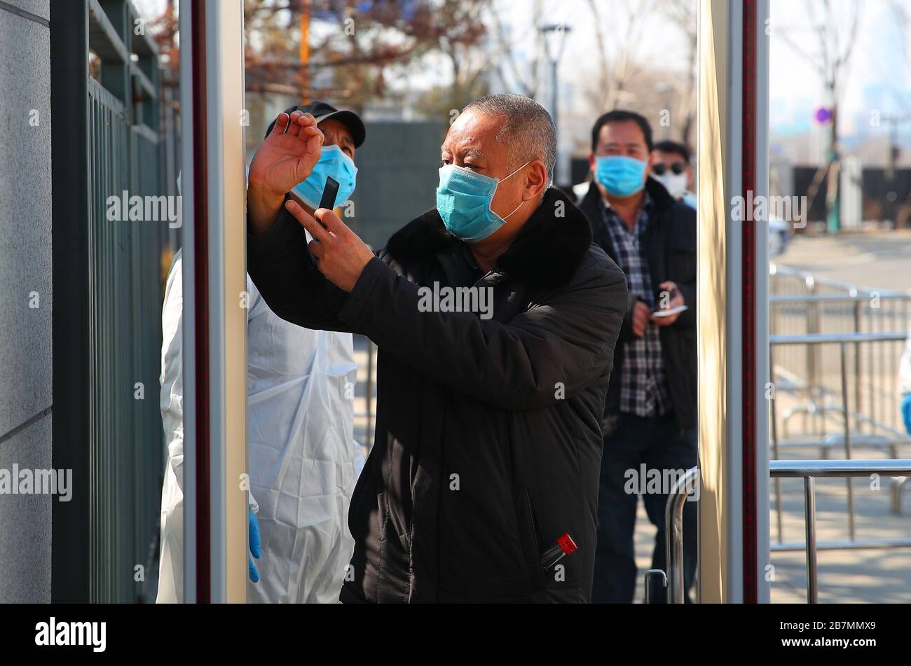 Shenyang, China's Liaoning Province. 17th Mar, 2020. People receive ...