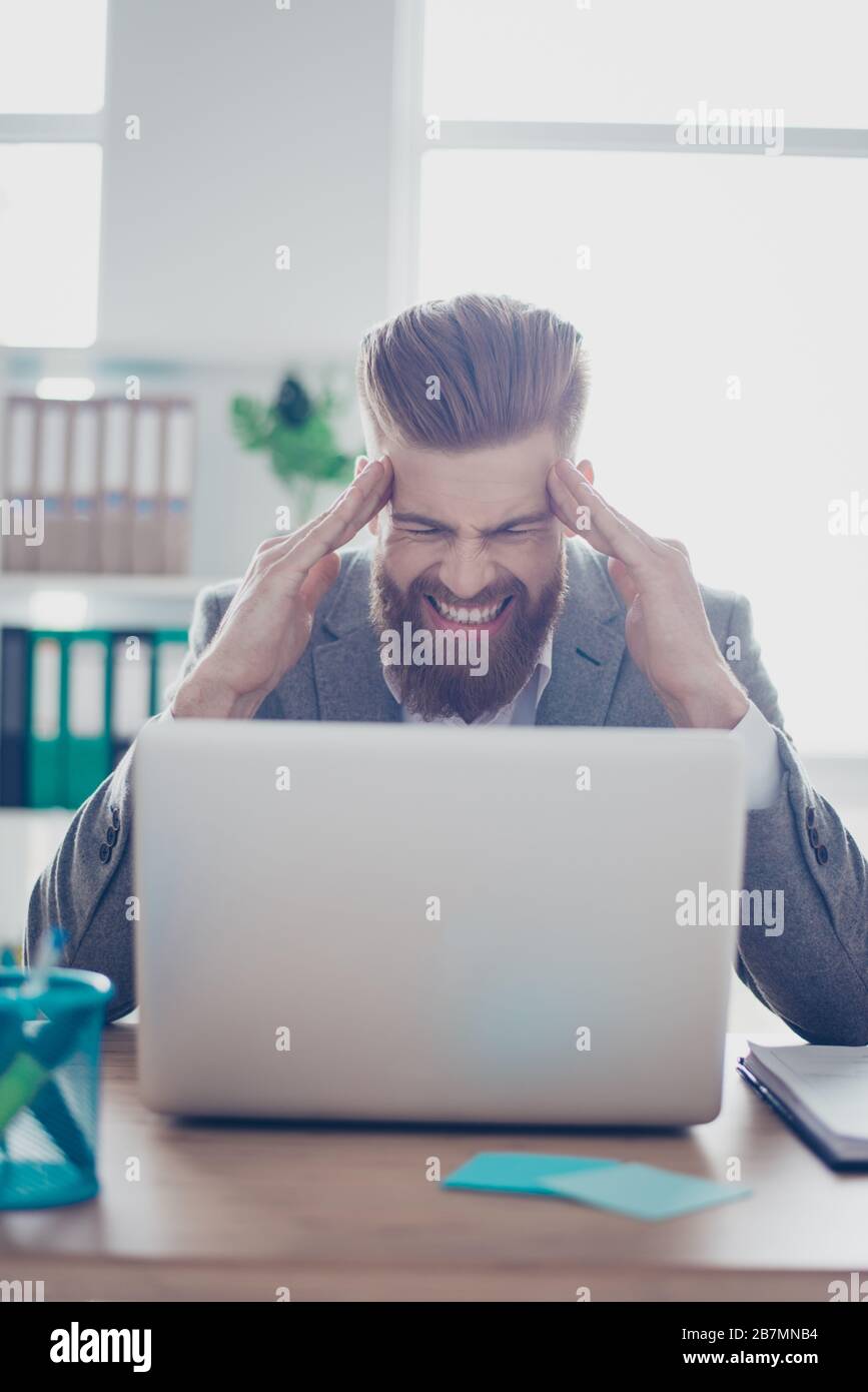 Overworked stressed businessman is having headache and thinking how to ...