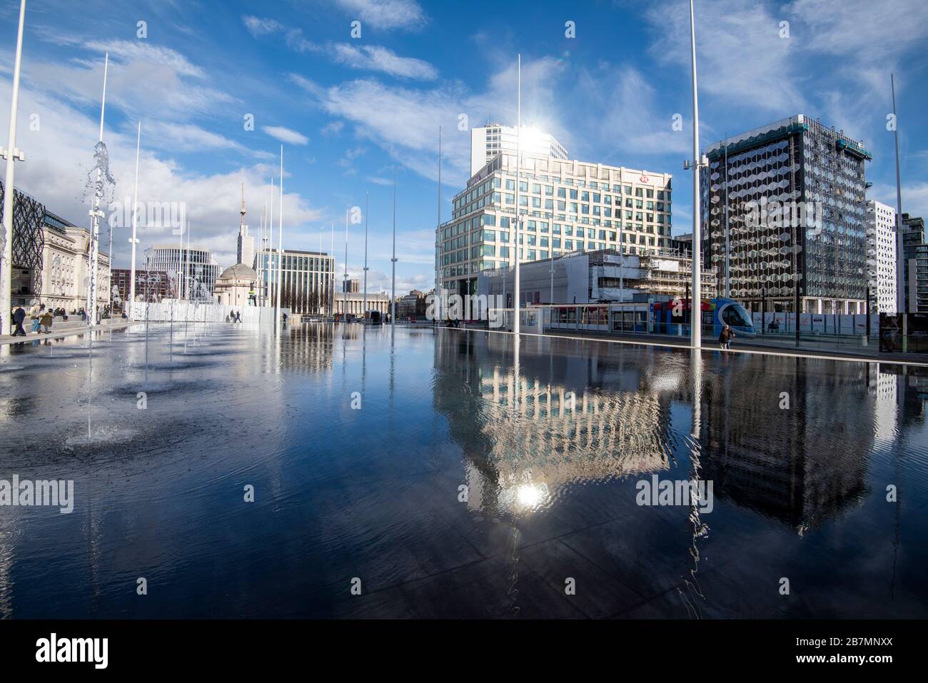 Construction projects reflected in a water feature in Centenary Square ...