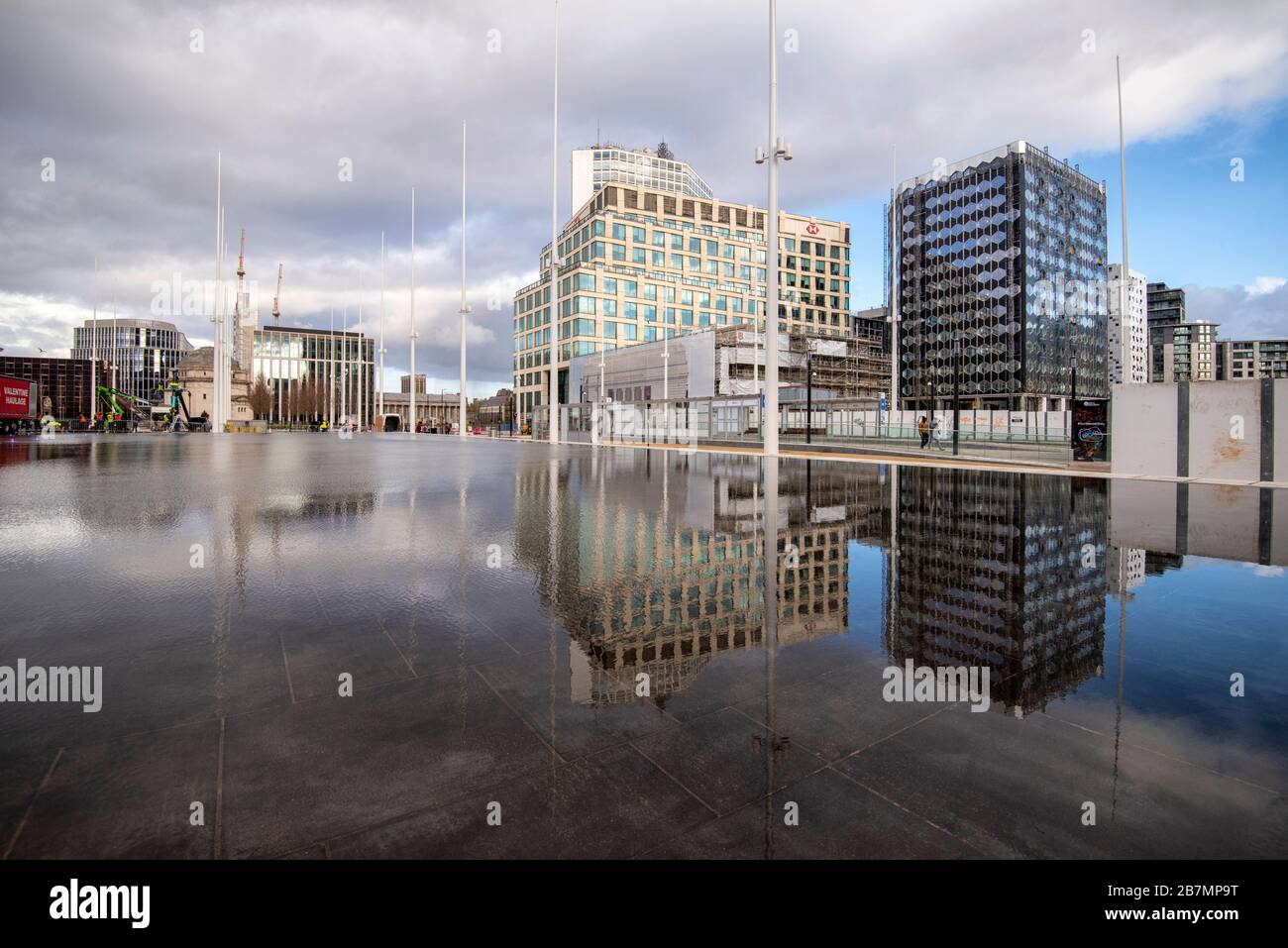 Construction projects reflected in a water feature in Centenary Square ...