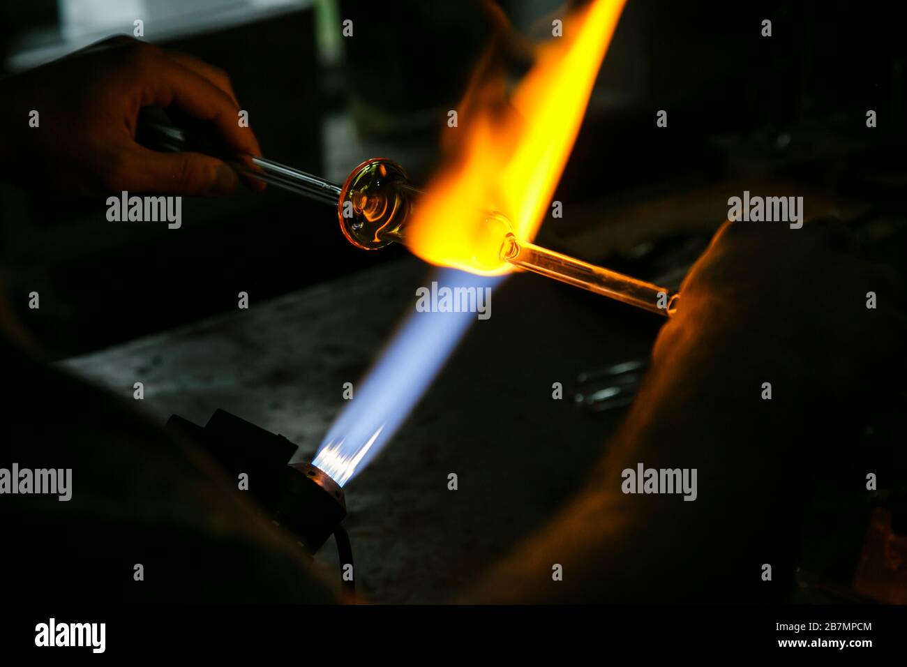 Process glass blowing manufacturing . Fire heats glass blank with glass ...