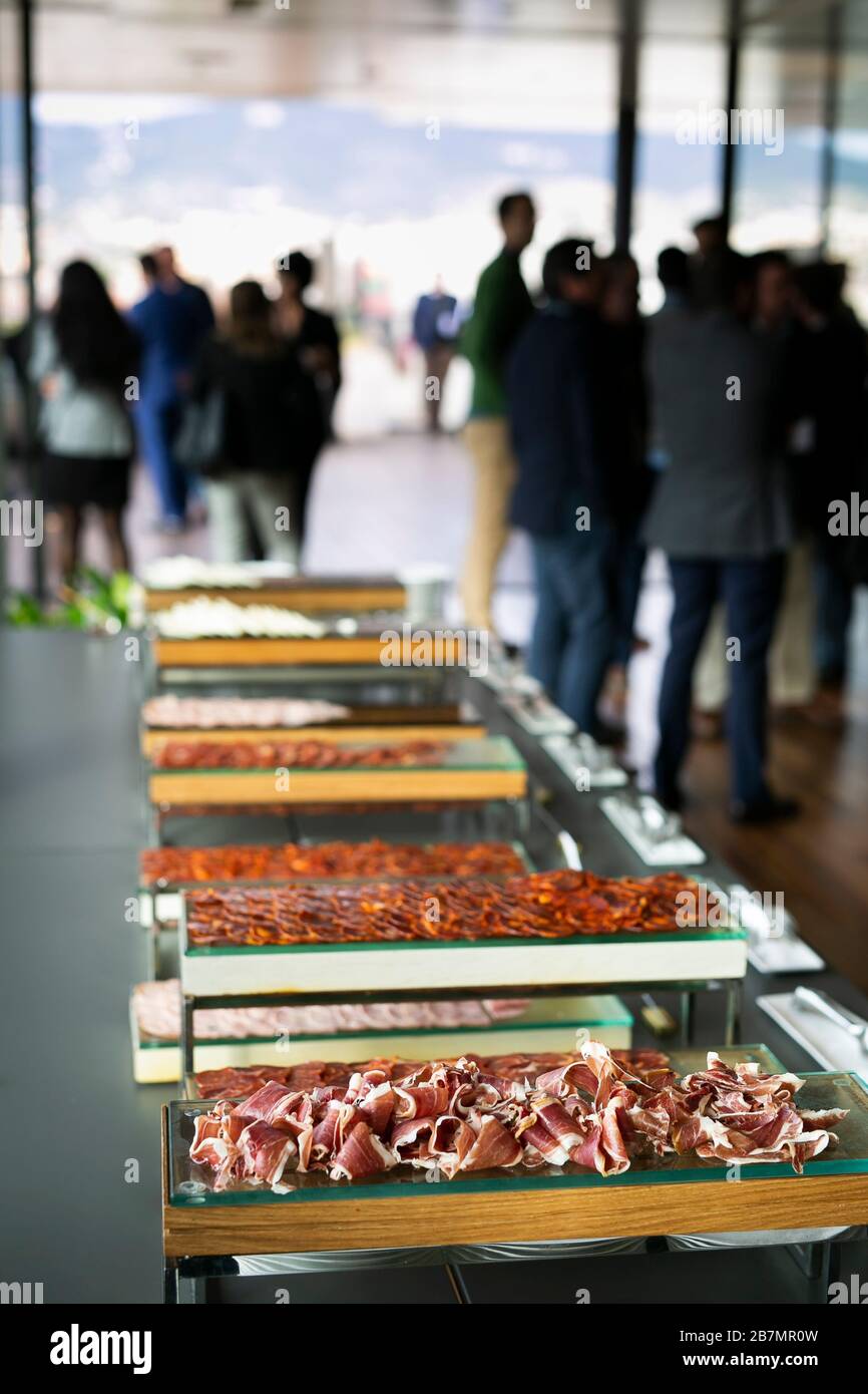 Spanish cold meats and cheese platter on a food station during an event ...