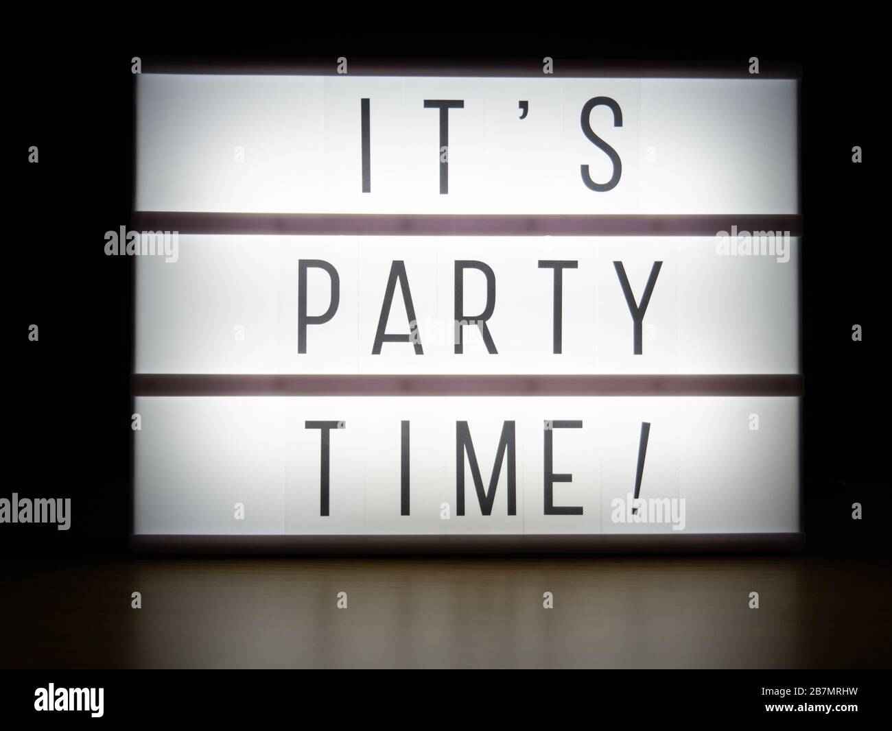 LED light box it's party time message in dark Stock Photo - Alamy