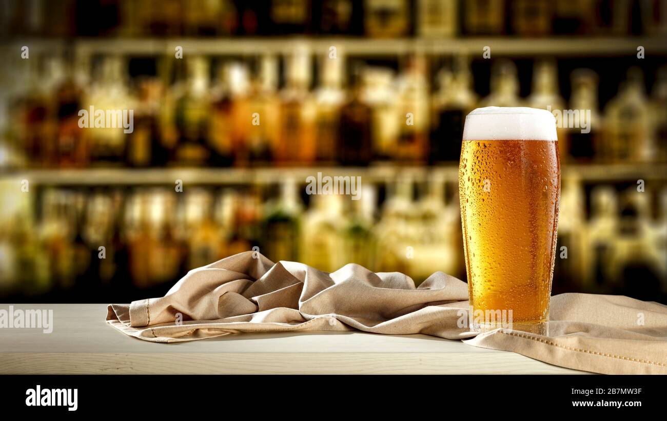 Beer in bar and free space for your product Stock Photo - Alamy