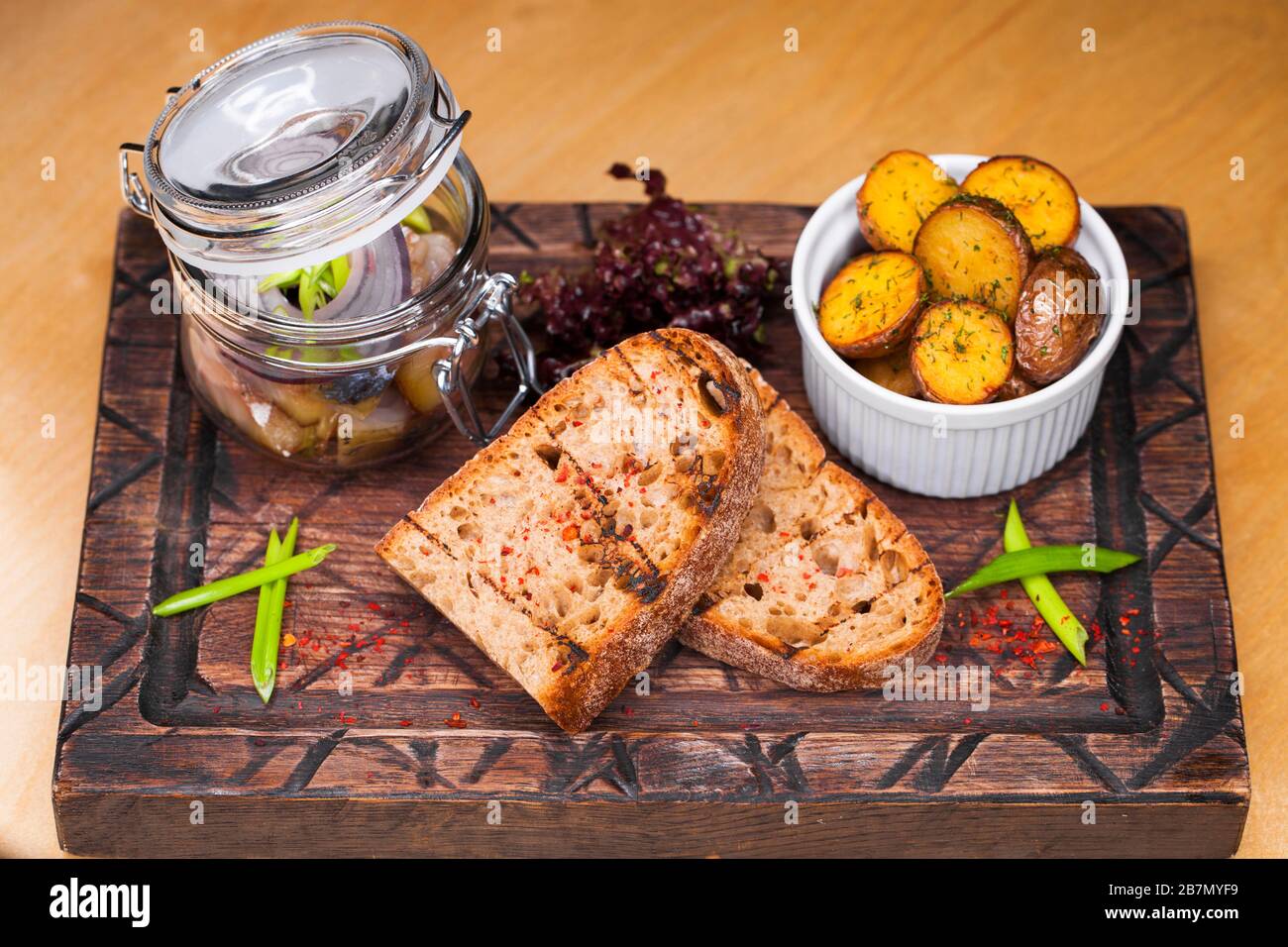 Restaurant dish - Marinated mackerel in a glass jar - snack under vodka ...