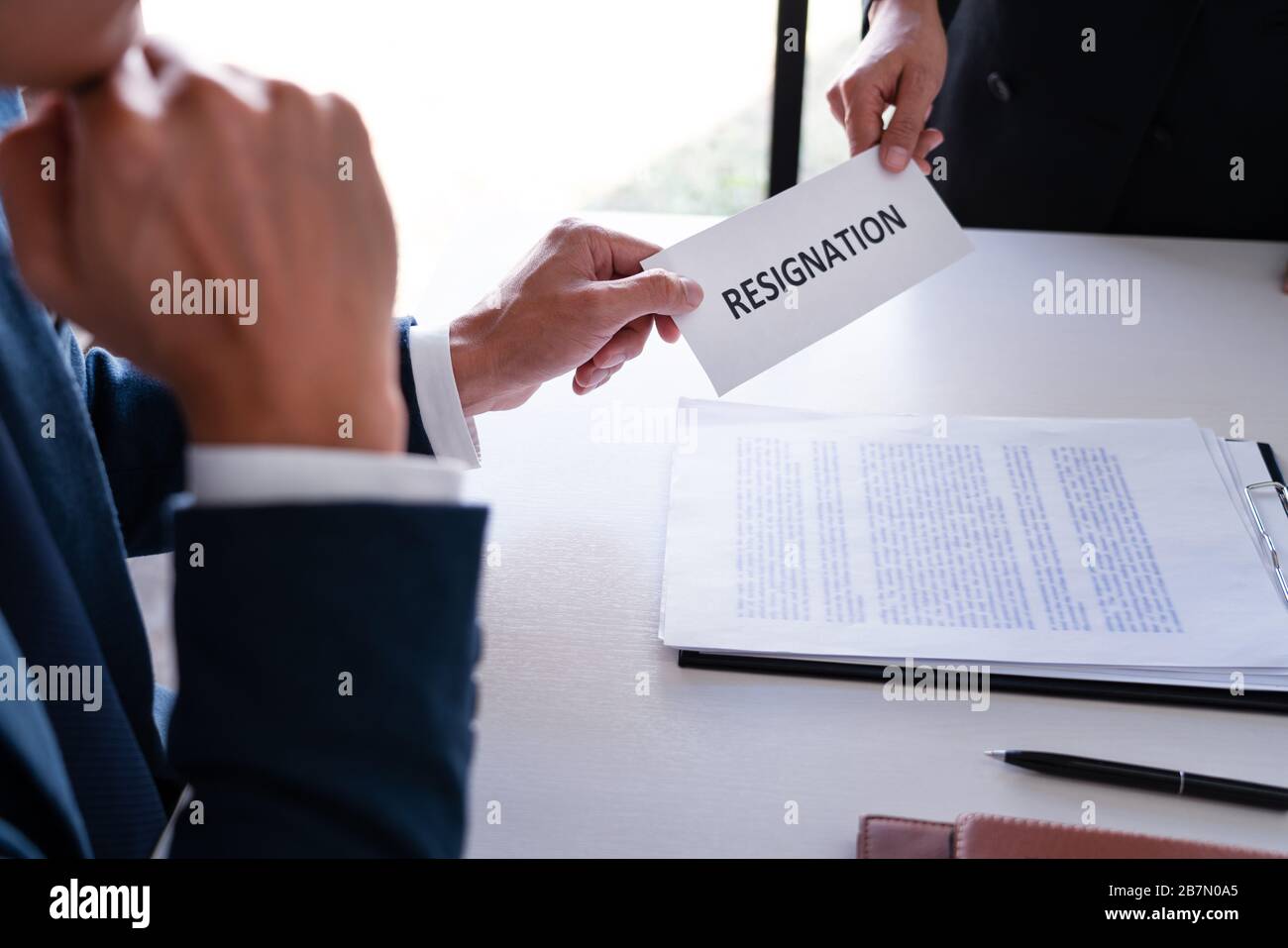 Employee businessman submit or sending resignation document letter to ...