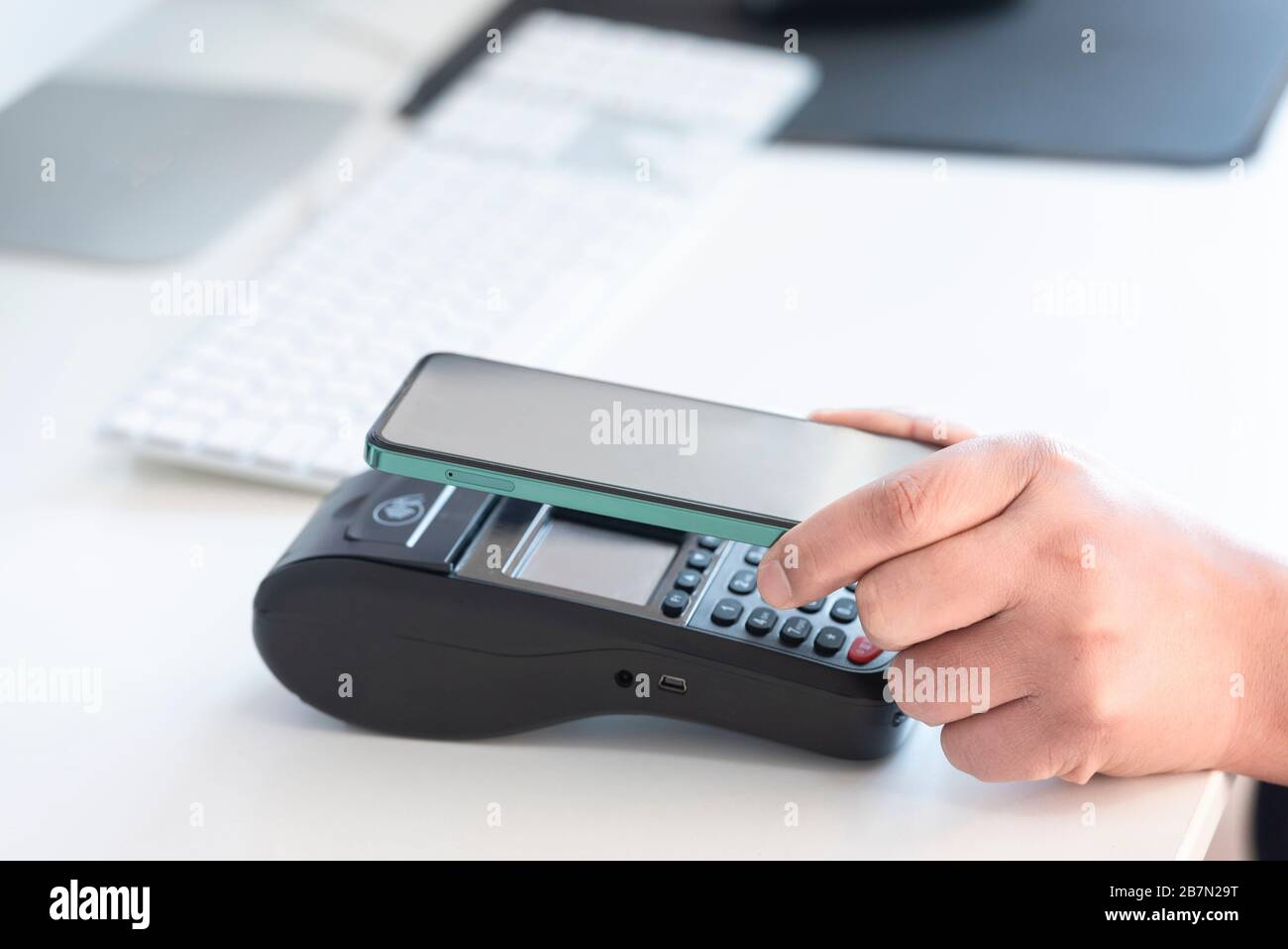 Cell phones and POS machines in the Office Stock Photo - Alamy