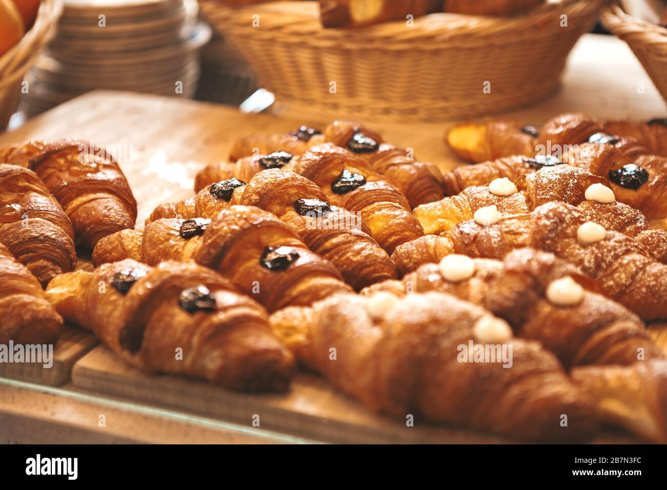 Various flavours of croissant in a bakery Stock Photo - Alamy